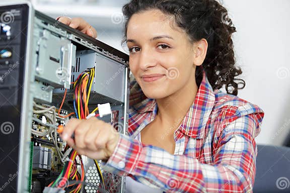 Happy Woman Fixing Computer at Desk at Work Stock Photo - Image of ...