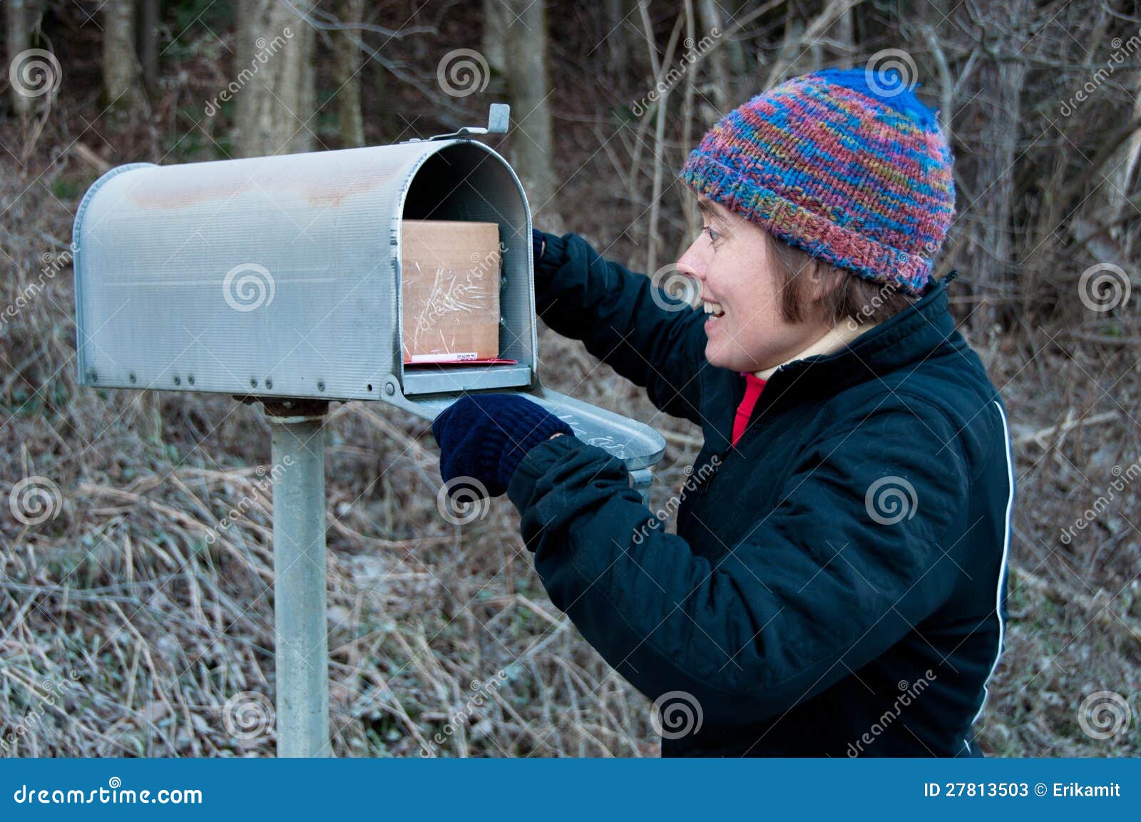 Happy woman gets a package stock image. Image of envelopes - 27813503