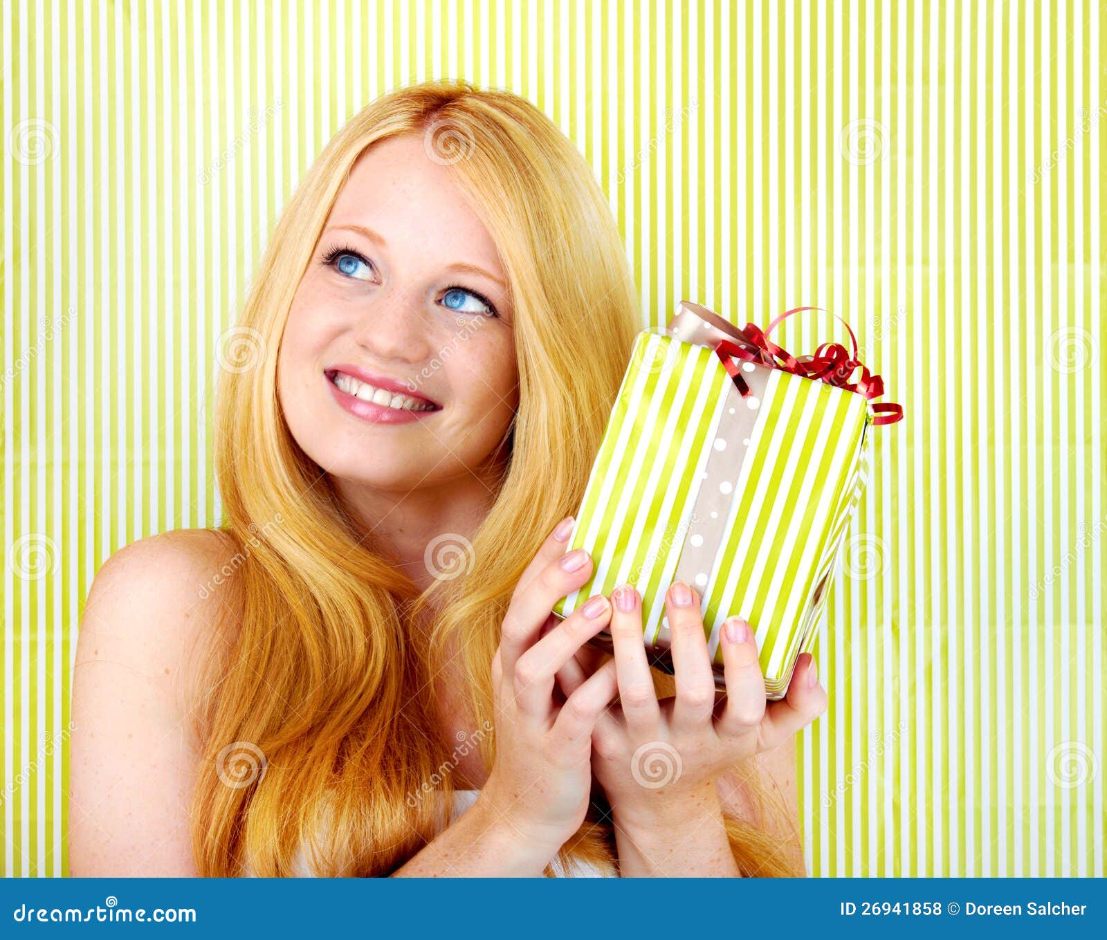 Happy woman with a gift stock photo. Image of expression - 26941858