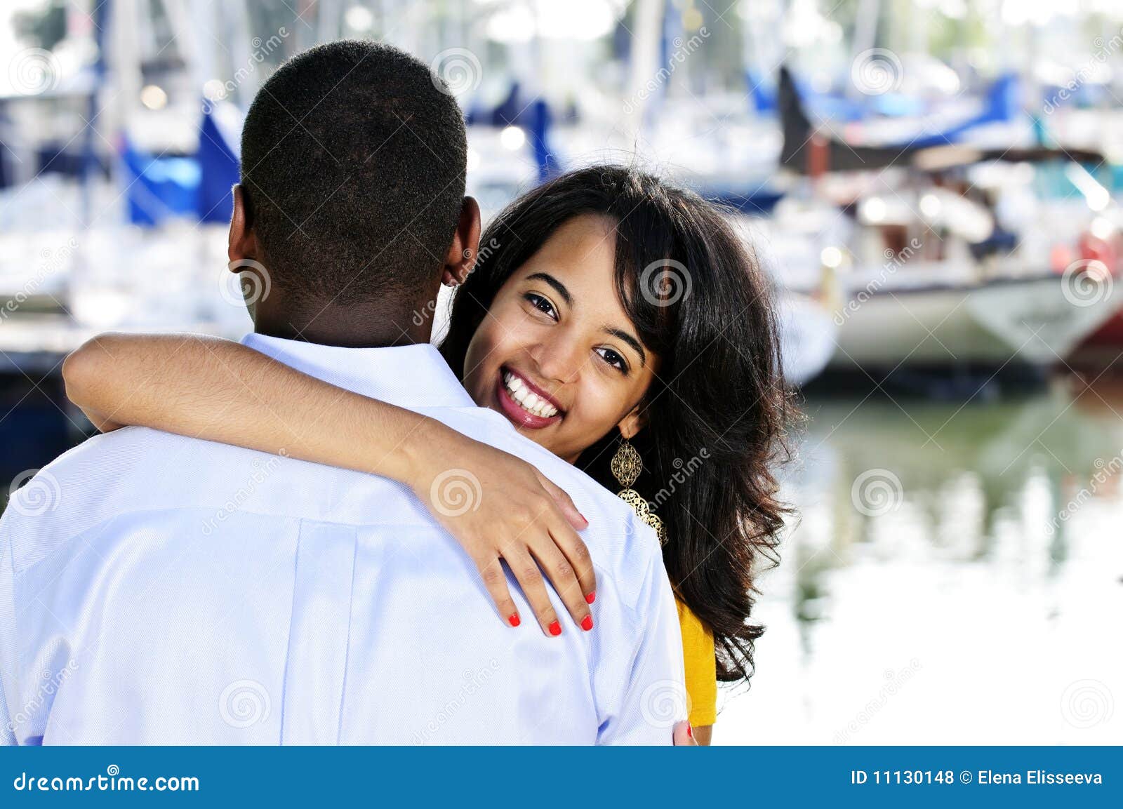 Happy woman hugging man stock photo. Image of ethnic - 11130148