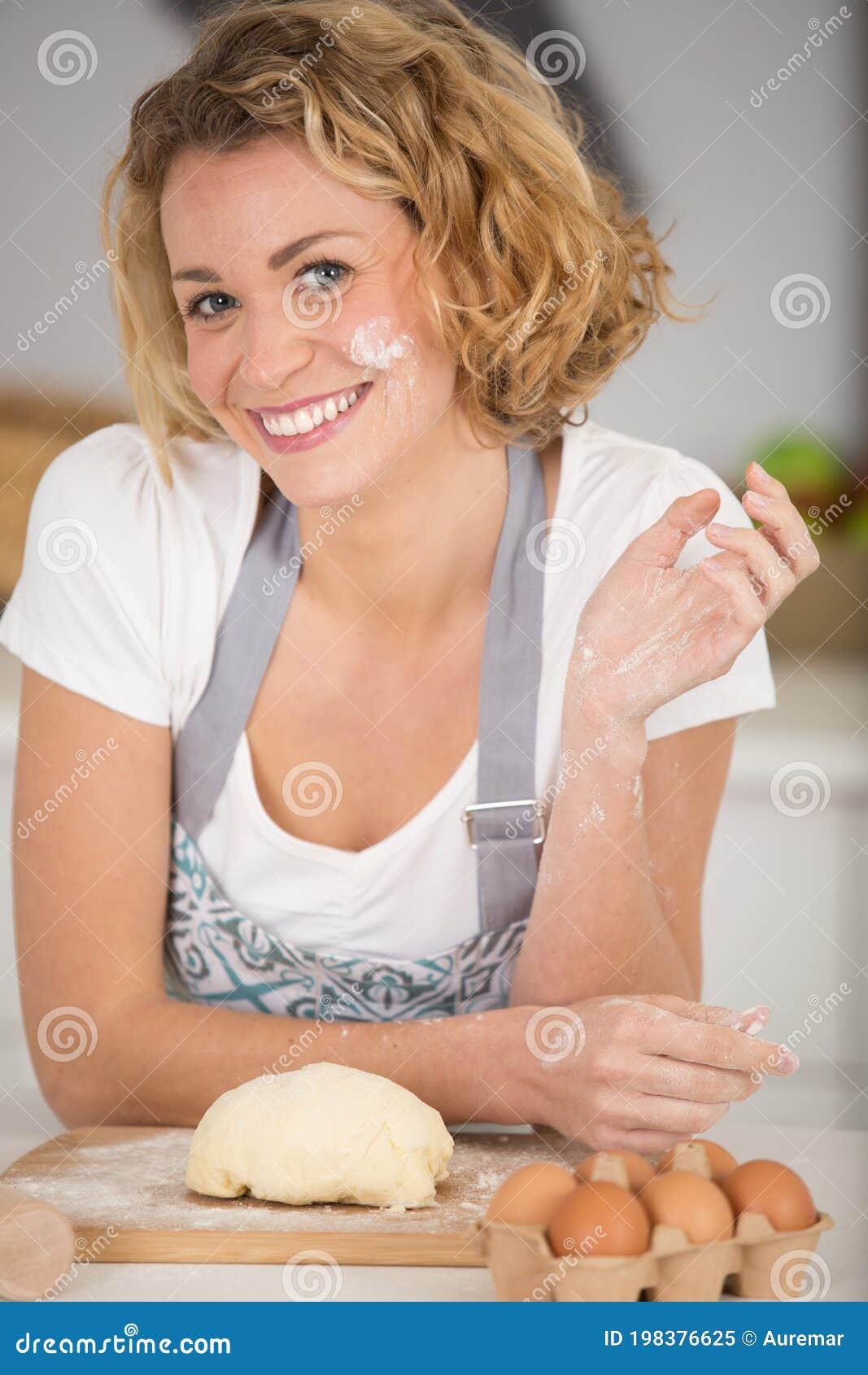 Happy woman kneading dough stock image. Image of baking - 198376625
