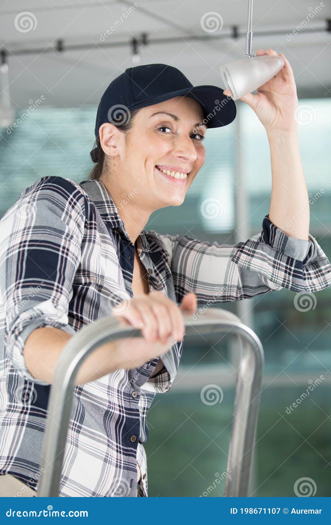 Happy woman on ladder stock image. Image of house, armsraised - 198671107