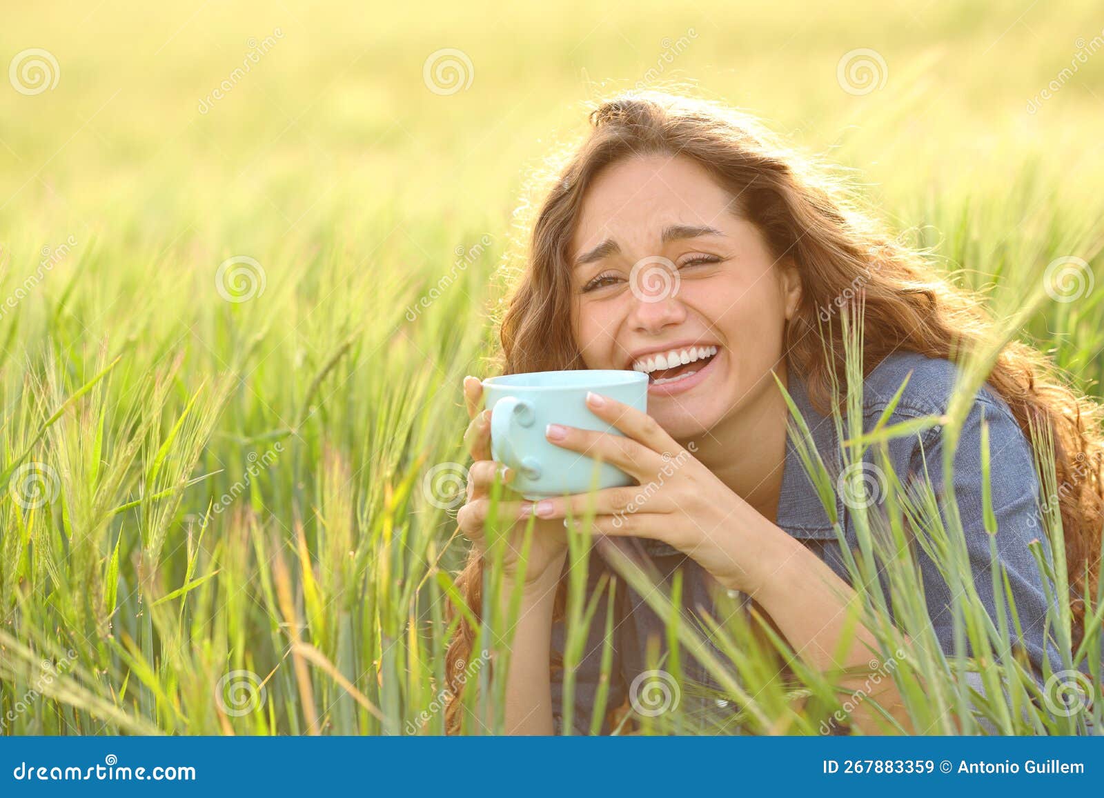 Happy Woman Laughing Drinking Coffee in a Field Stock Image - Image of ...