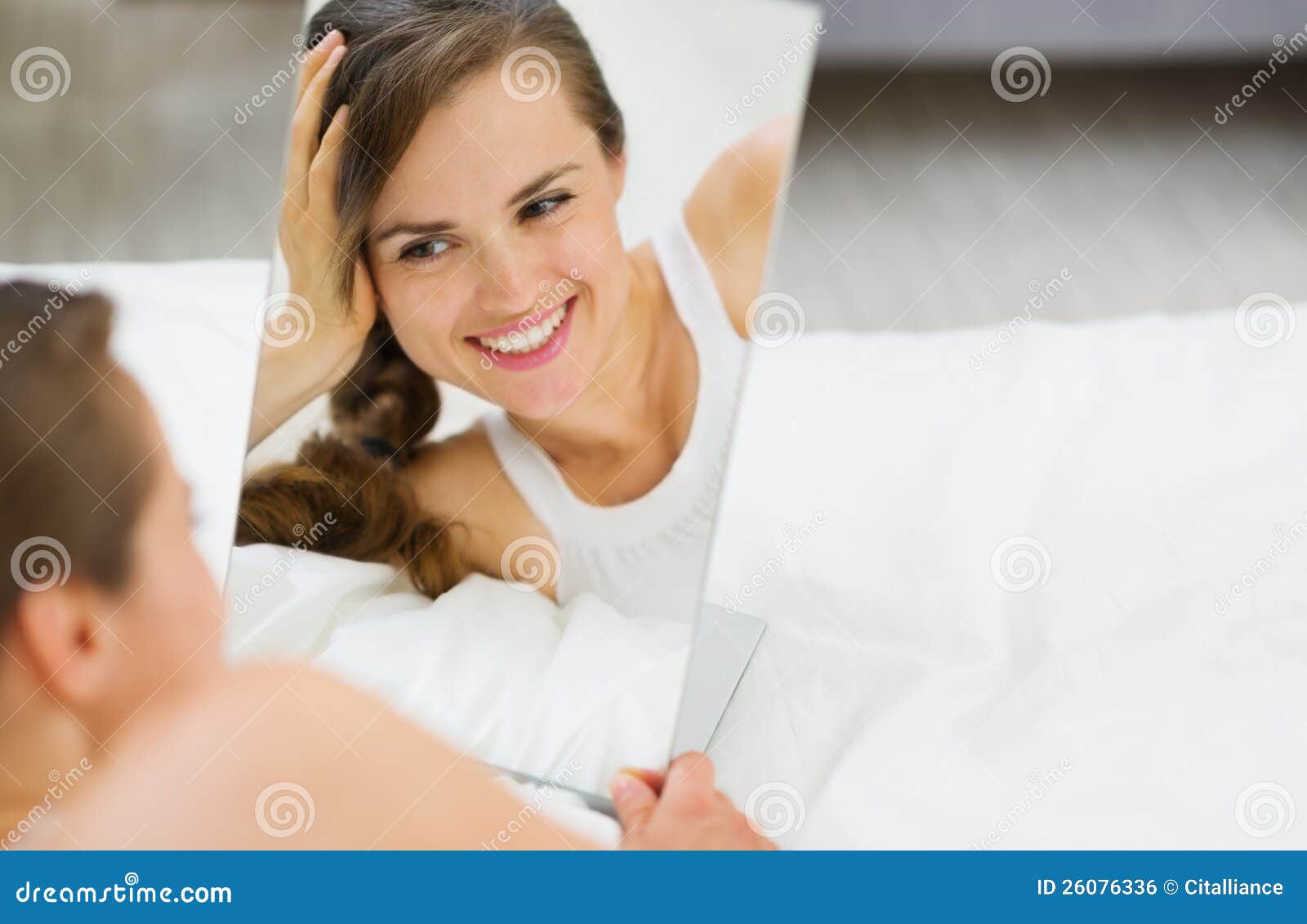 Happy Woman Laying on Bed and Looking on Mirror Stock Photo - Image of ...