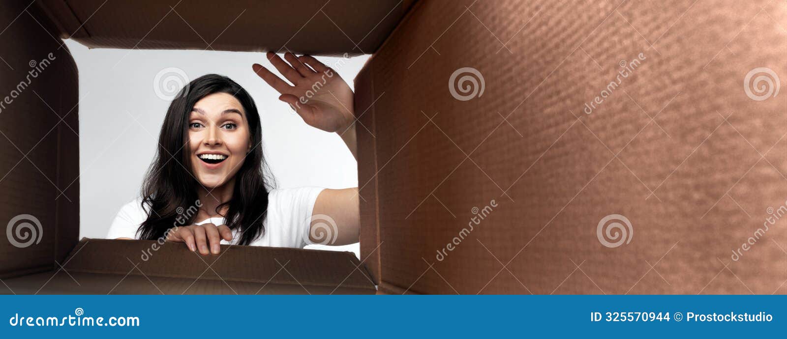 Happy Woman Looking into Cardboard Box, Bottom View Stock Photo - Image ...