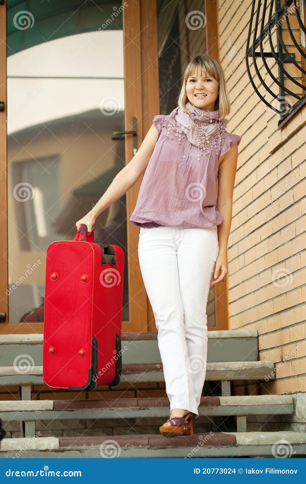 Happy woman with luggage stock photo. Image of estate - 20773024