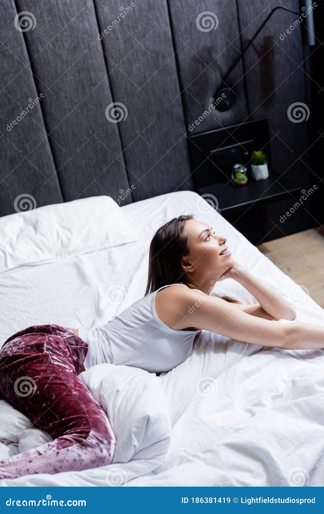 Happy Woman Lying on Bed at Stock Image - Image of european, quarantine ...