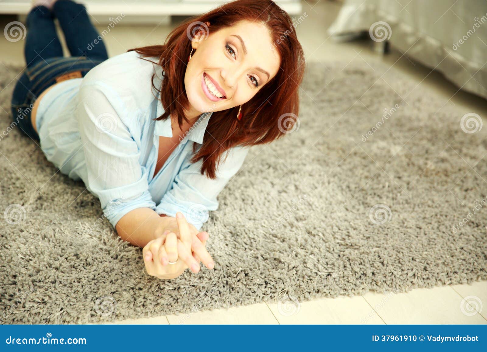 Happy Woman Lying on the Carpet Stock Photo - Image of gorgeous ...