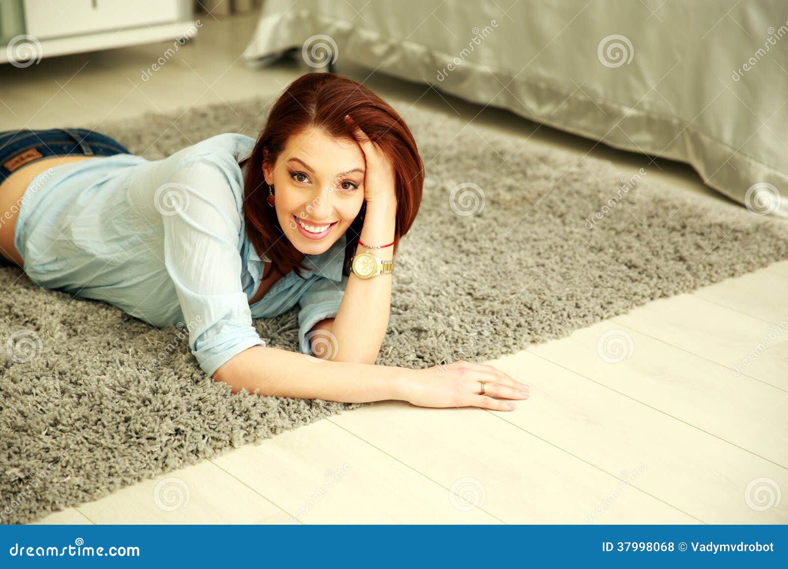 Happy Woman Lying on the Carpet Stock Photo - Image of cheerful ...