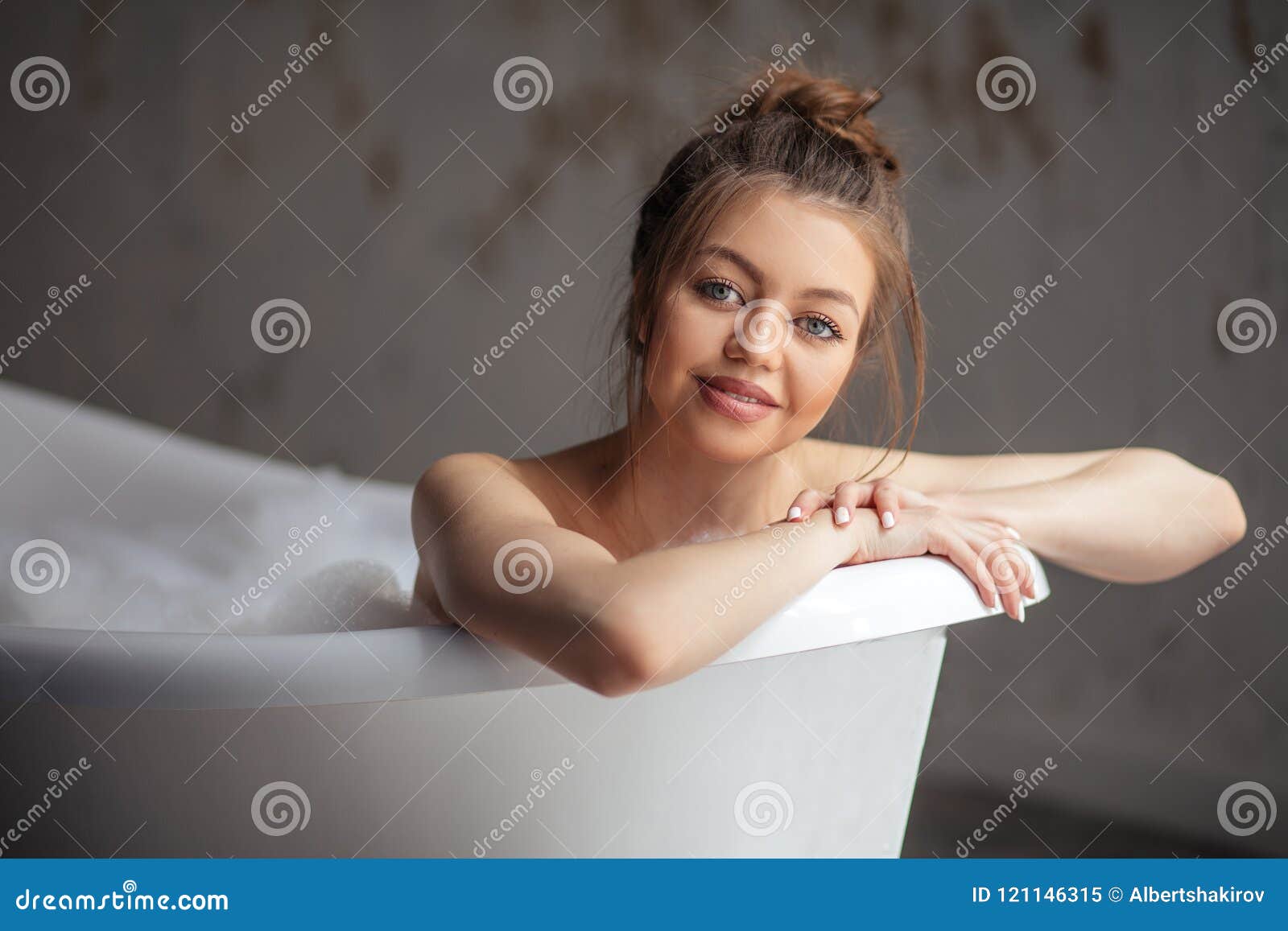 Happy Woman Lying in the Tub and Looking at Camera Stock Image - Image ...