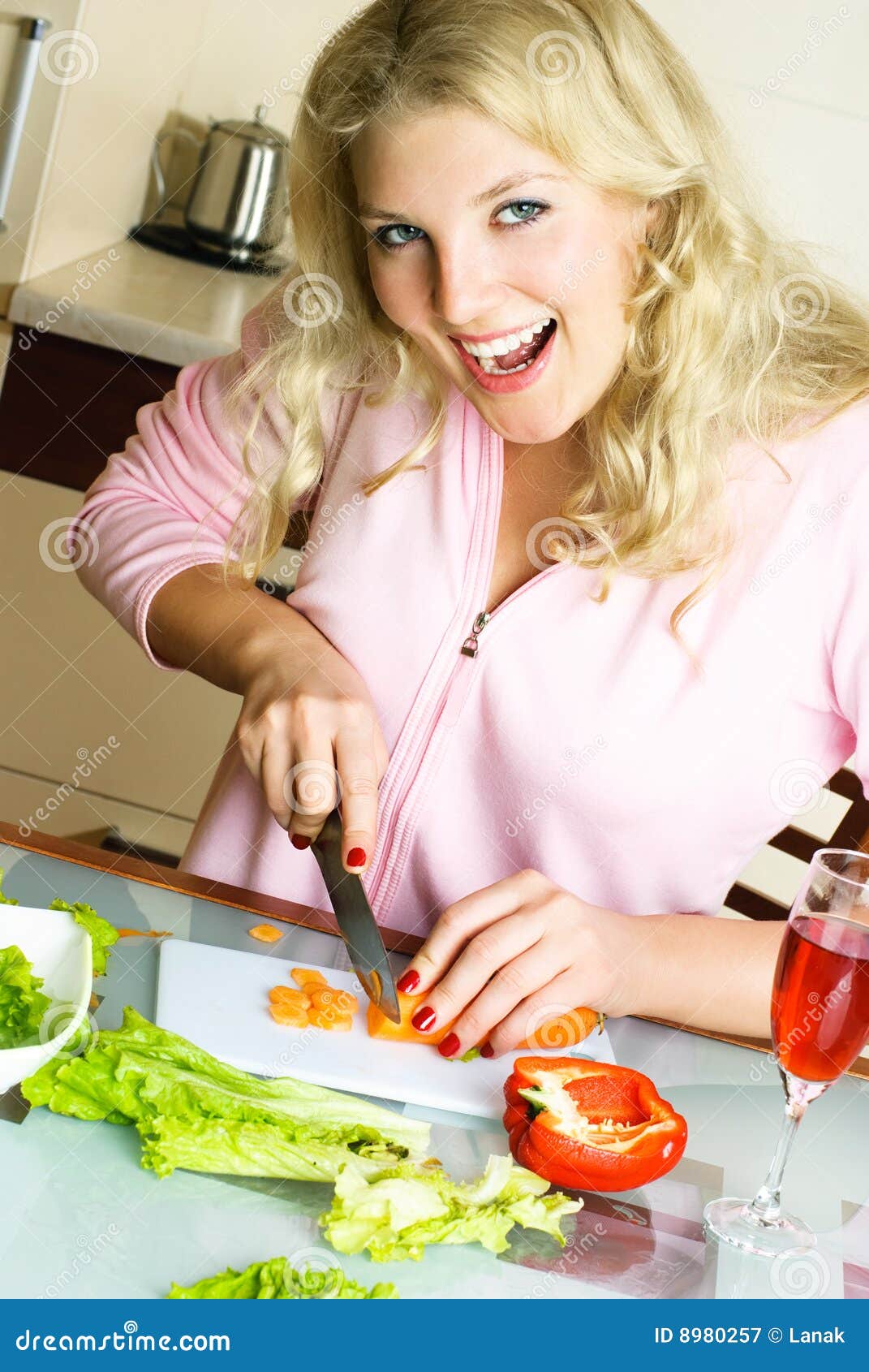Happy woman making salad stock image. Image of kitchen - 8980257