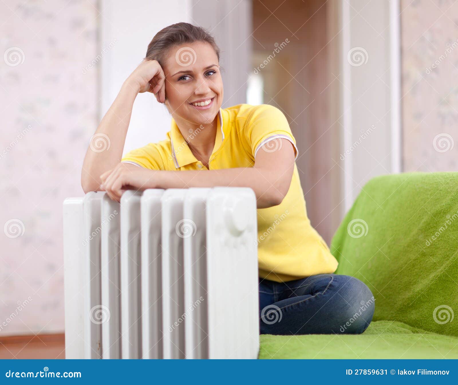 Happy woman near heater stock image. Image of economic - 27859631