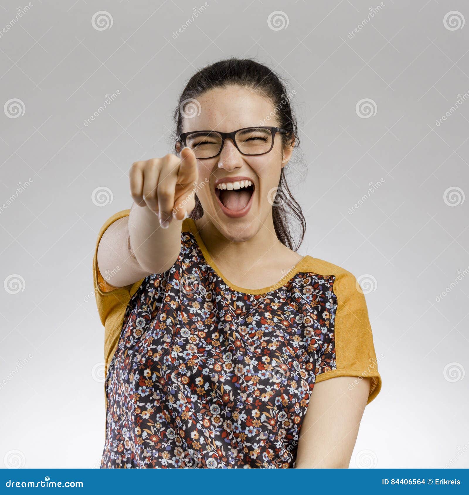 Happy woman pointing stock photo. Image of studio, people - 84406564