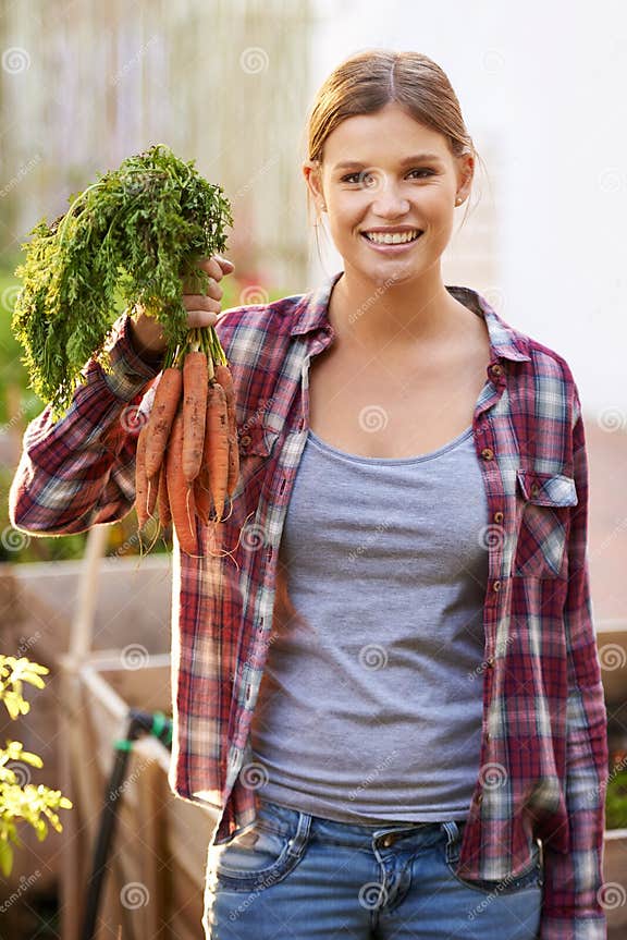 Happy Woman Portrait And Farmer With Carrots In Harvest Garden Or