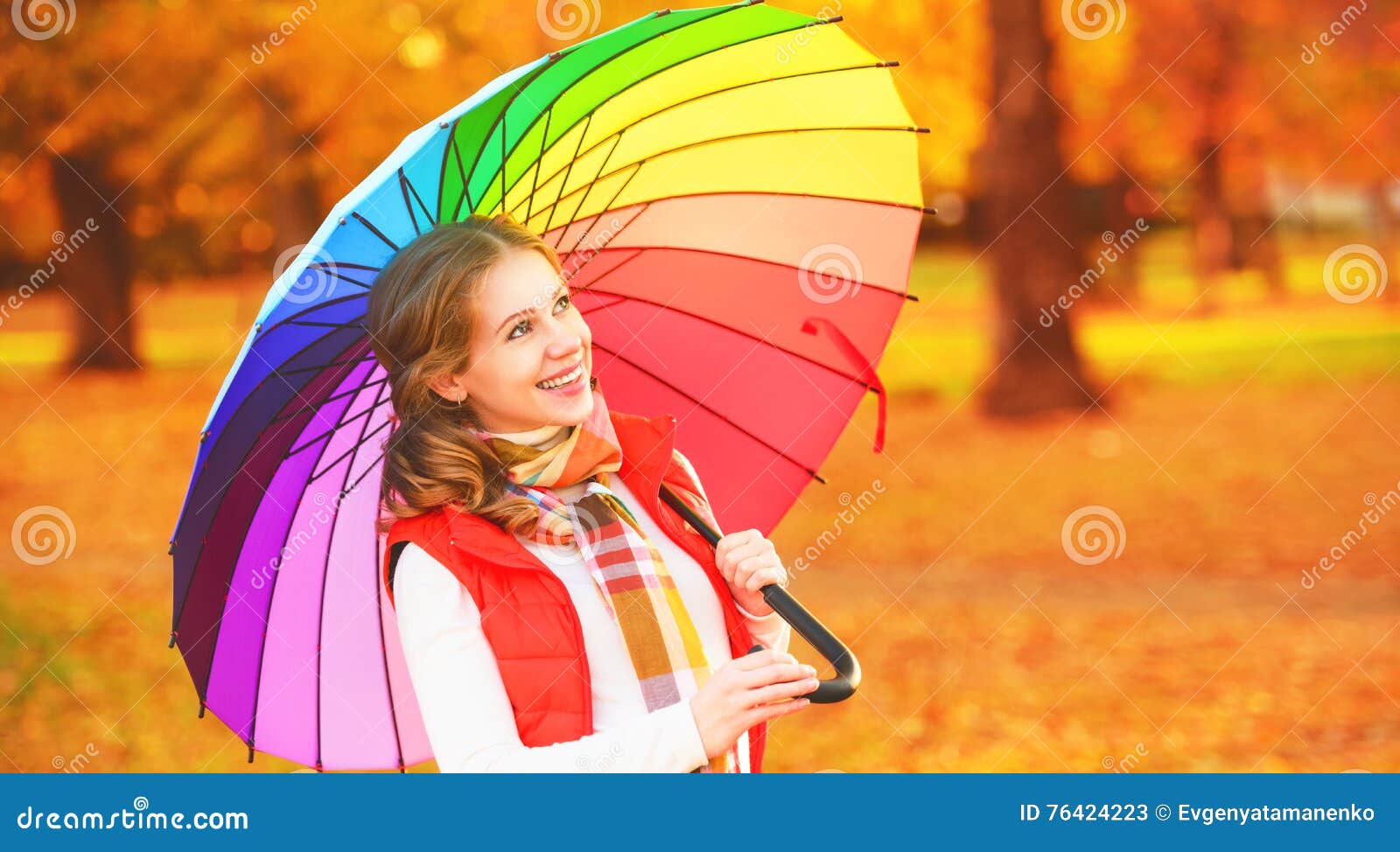 Happy Woman With Rainbow Multicolored Umbrella Under Rain In Par Stock