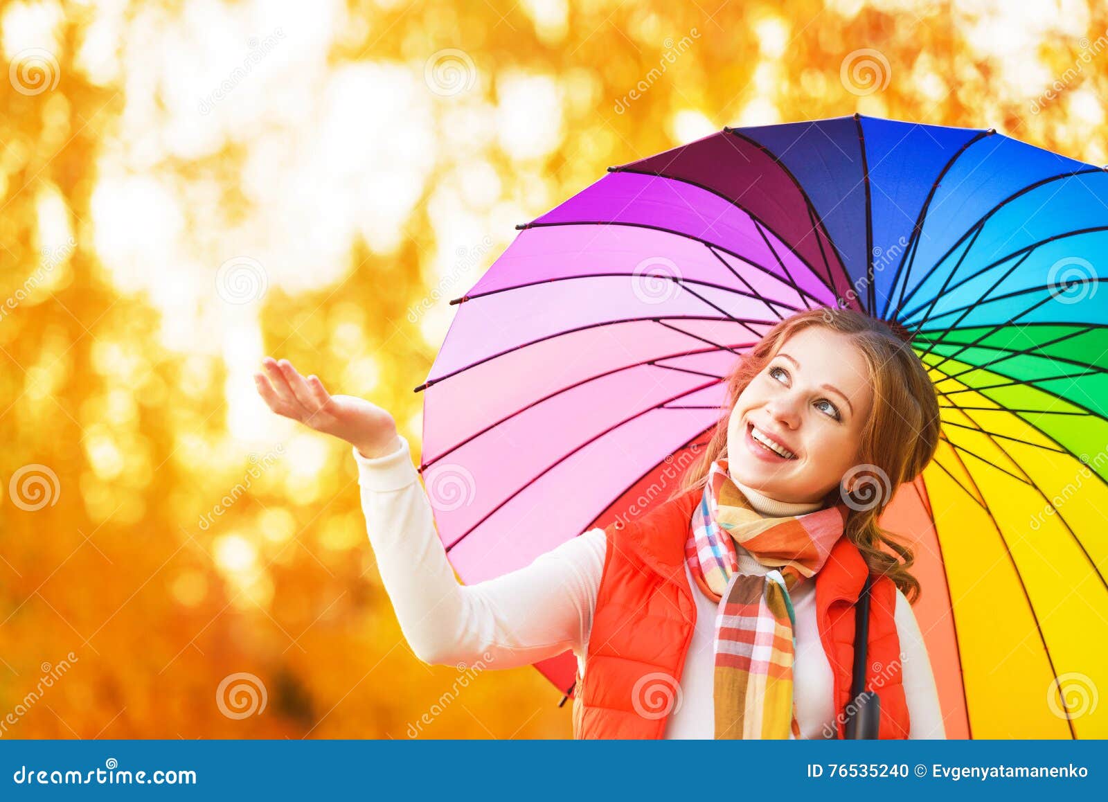 Happy Woman With Rainbow Multicolored Umbrella Under Rain In Par Stock