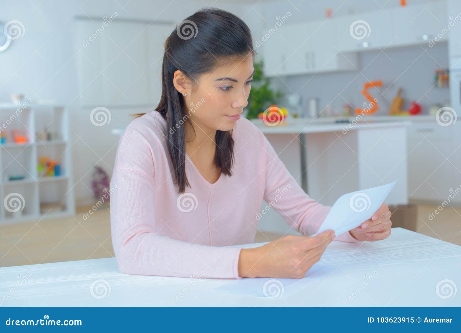 Happy woman reading letter stock image. Image of seated - 103623915
