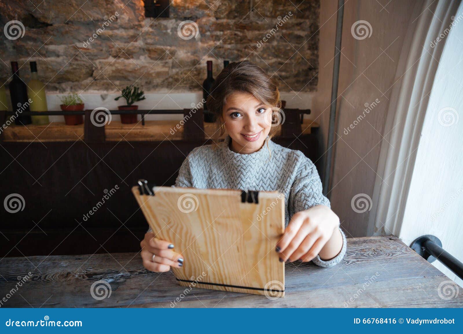 Happy woman reading menu stock photo. Image of cafe, enjoyment - 66768416