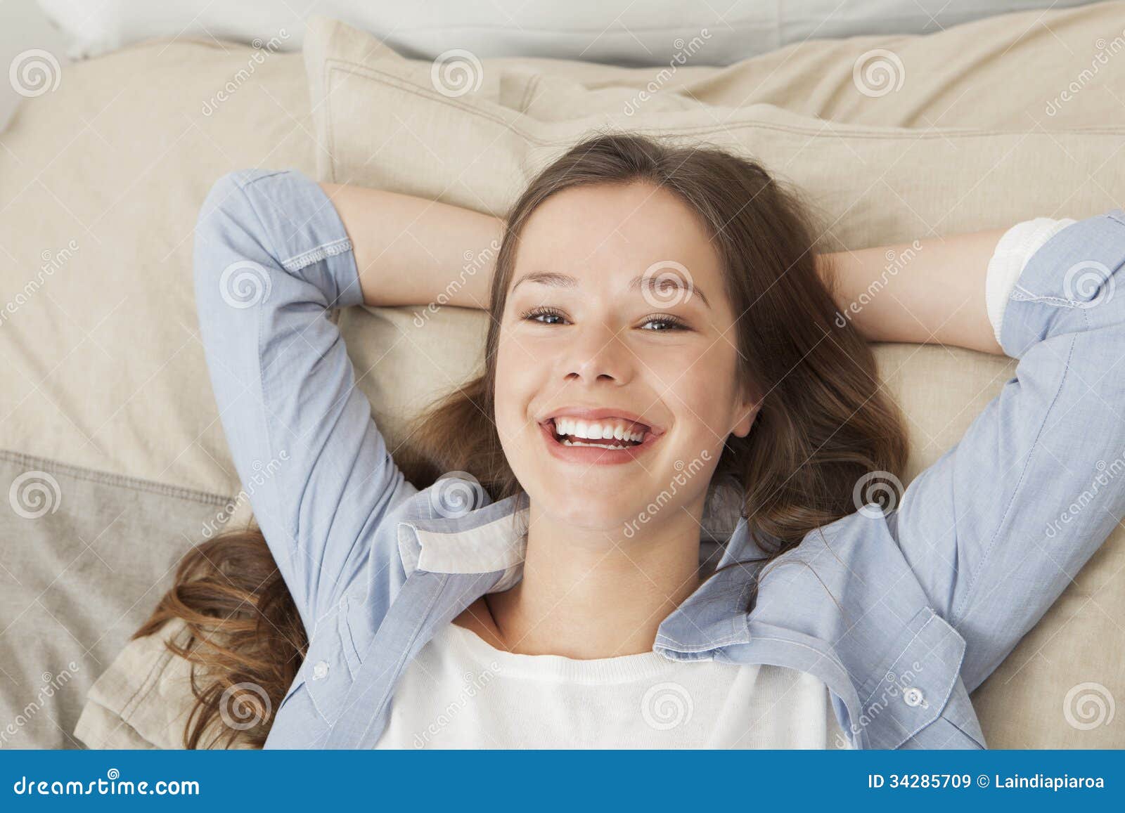 Happy Woman Resting on the Bed Stock Image - Image of brown, head: 34285709