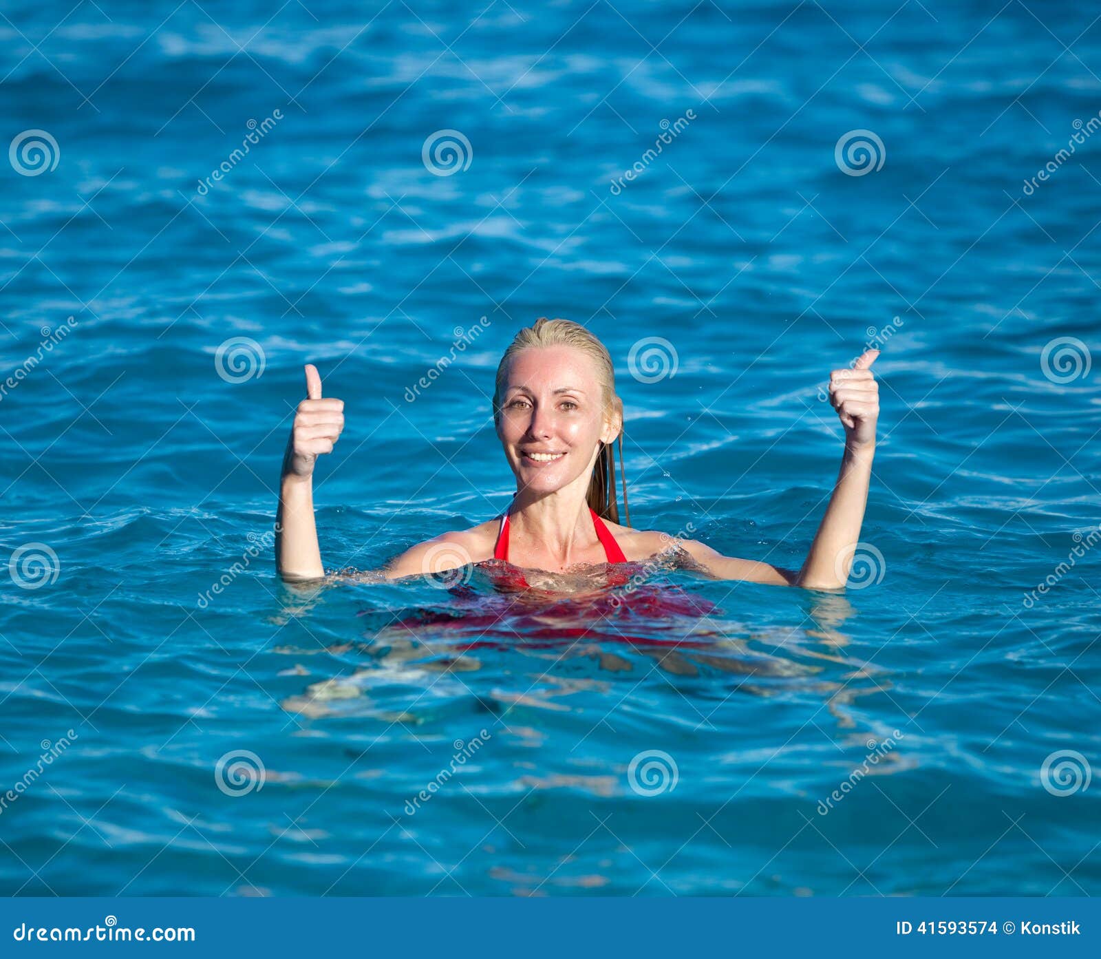 Happy Woman in the Sea Shows a Thumb Stock Photo - Image of atoll ...