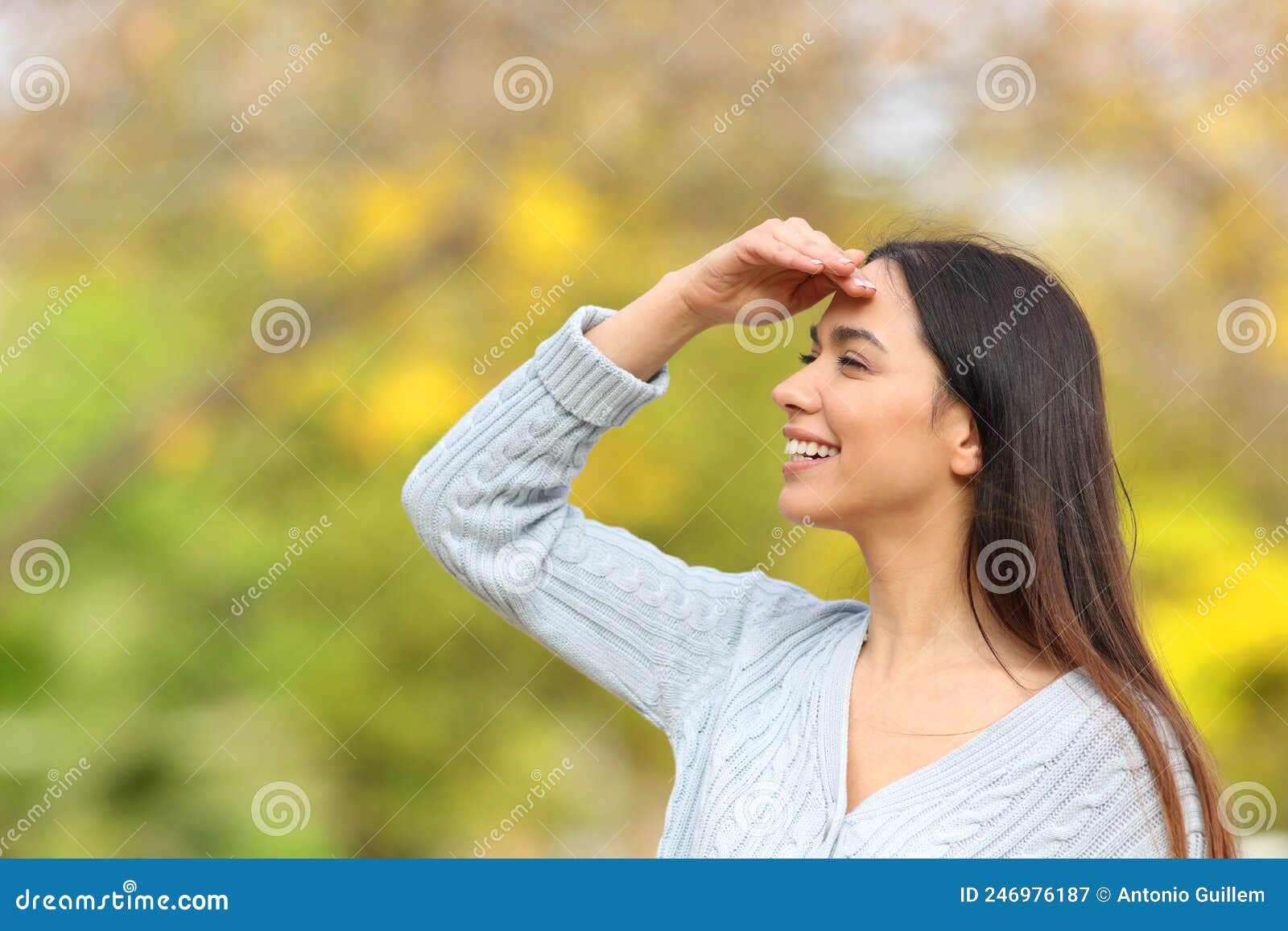 Happy Woman Searching with Hand on Forehead in a Park Stock Image ...