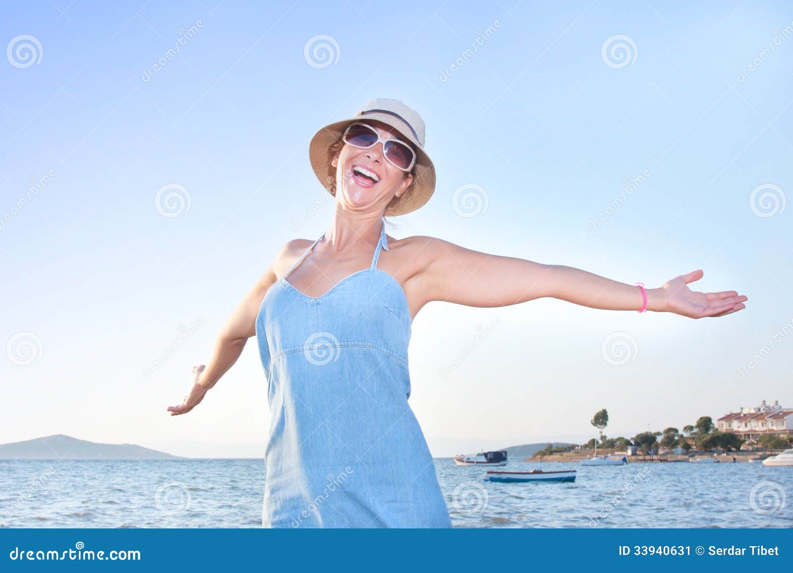 Happy woman at seaside stock image. Image of arms, dressed - 33940631