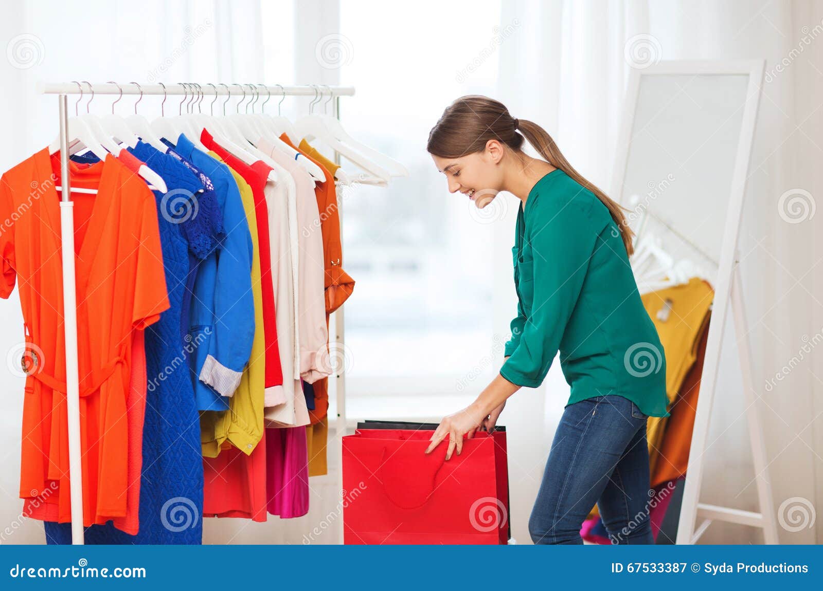 Happy Woman with Shopping Bags and Clothes at Home Stock Image - Image ... Happy Woman with Shopping Bags and Clothes at Home Stock Image - Image ...