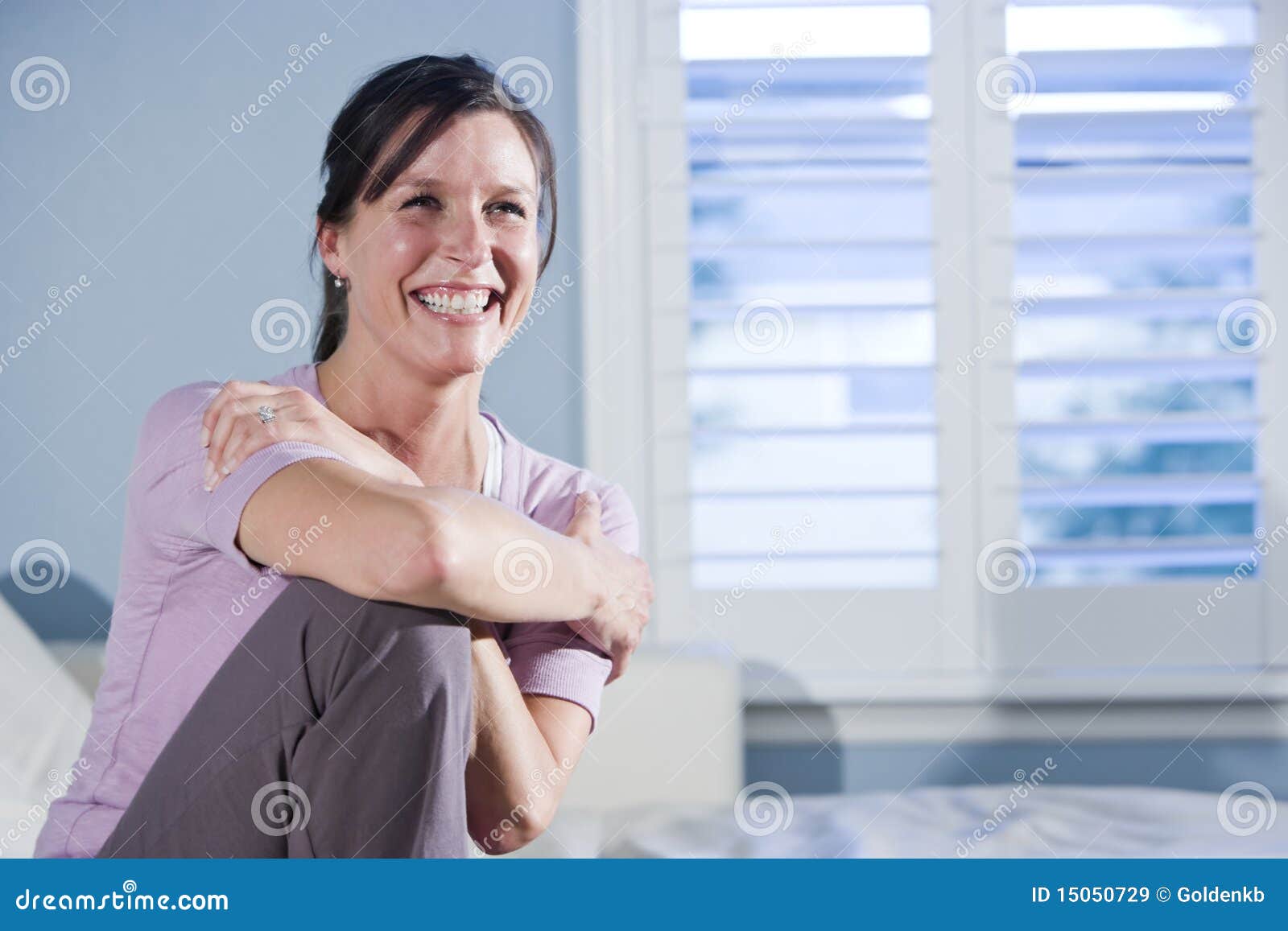 Happy Woman Sitting on Couch Smiling Stock Image - Image of caucasian ...