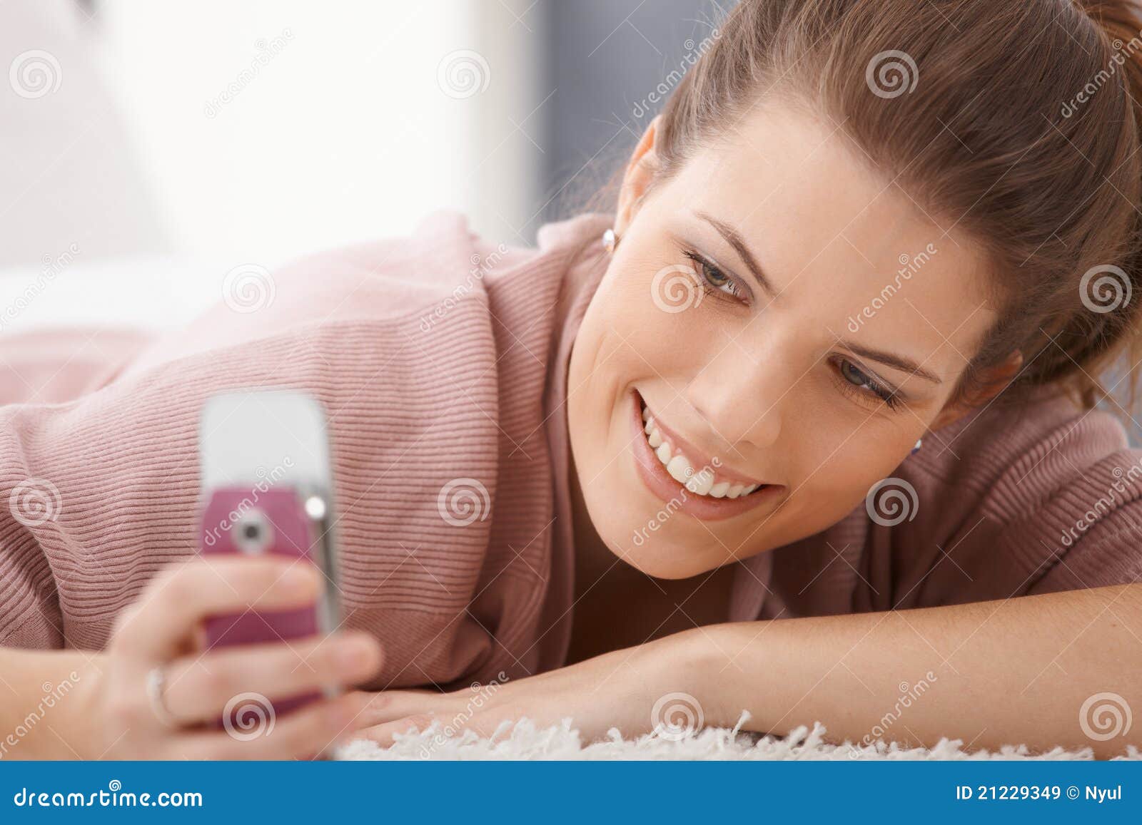 Happy woman texting stock image. Image of attractive - 21229349