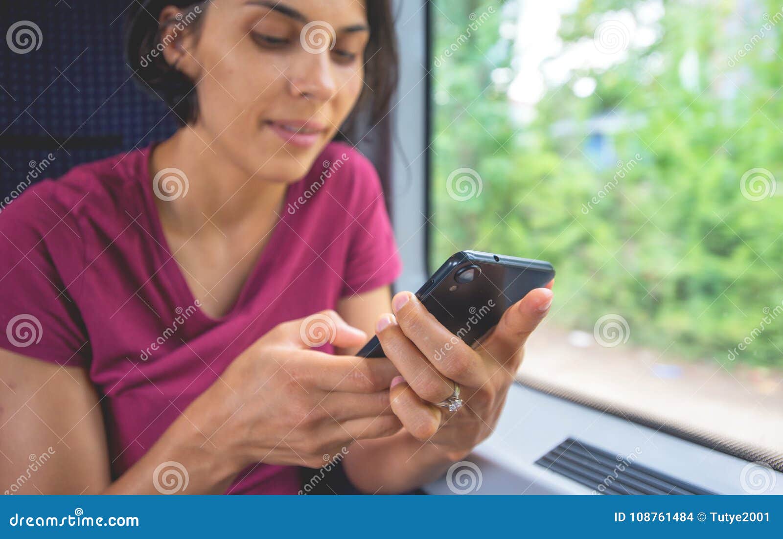 Woman Texting on Her Phone during Her Trip in Train Stock Photo - Image ... Woman Texting on Her Phone during Her Trip in Train Stock Photo - Image ...