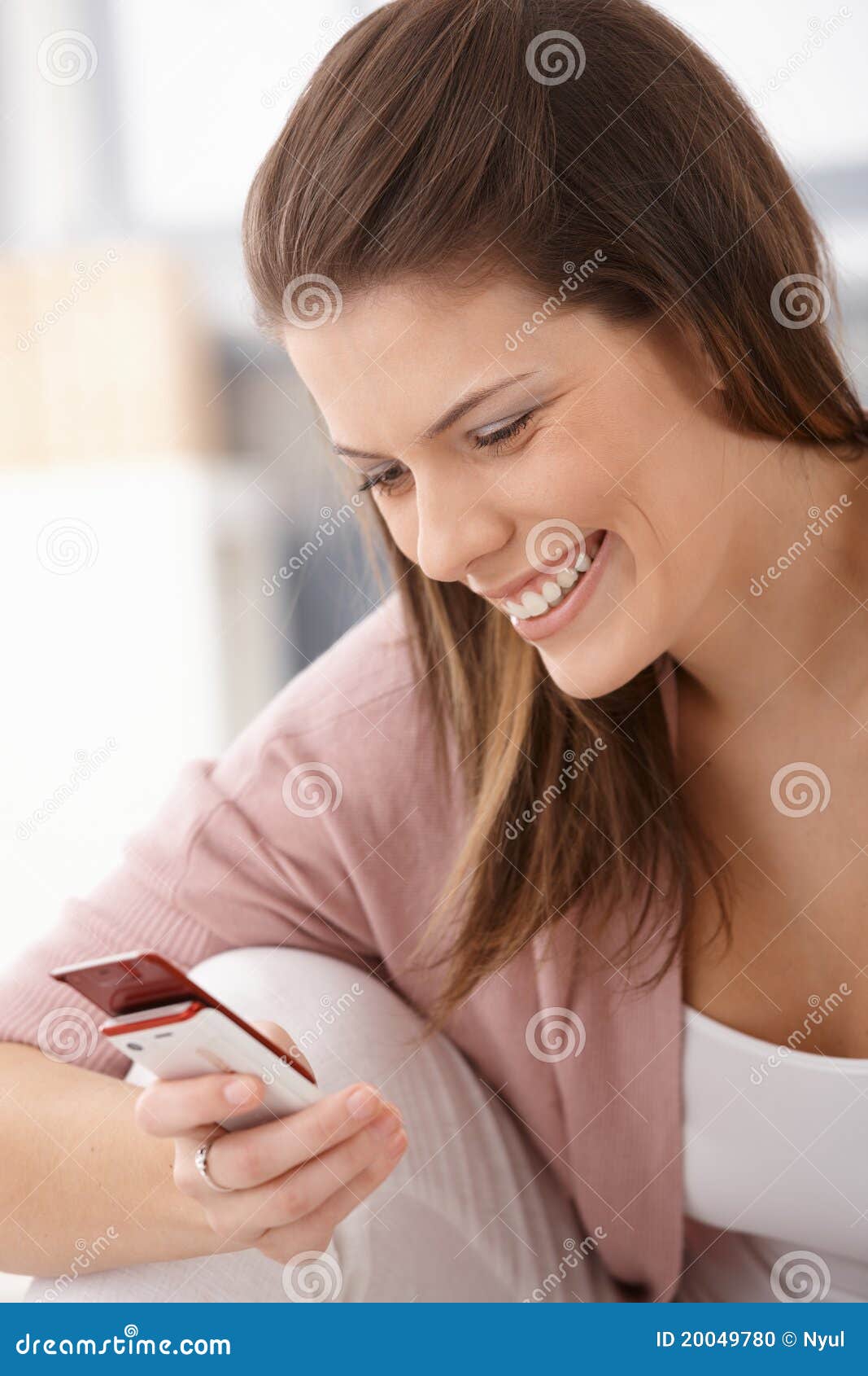 Happy Woman Texting on Mobile Phone Stock Photo - Image of home, laugh ...