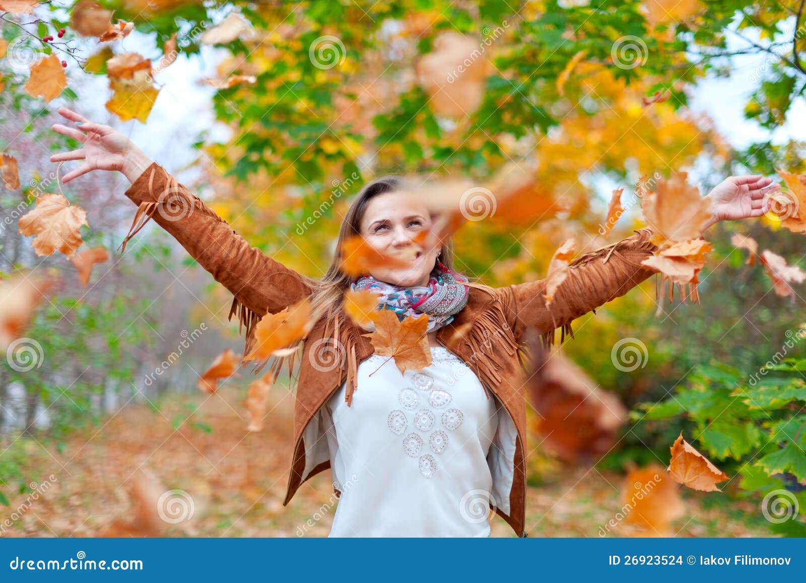 Happy woman throws leaves stock photo. Image of jacket - 26923524