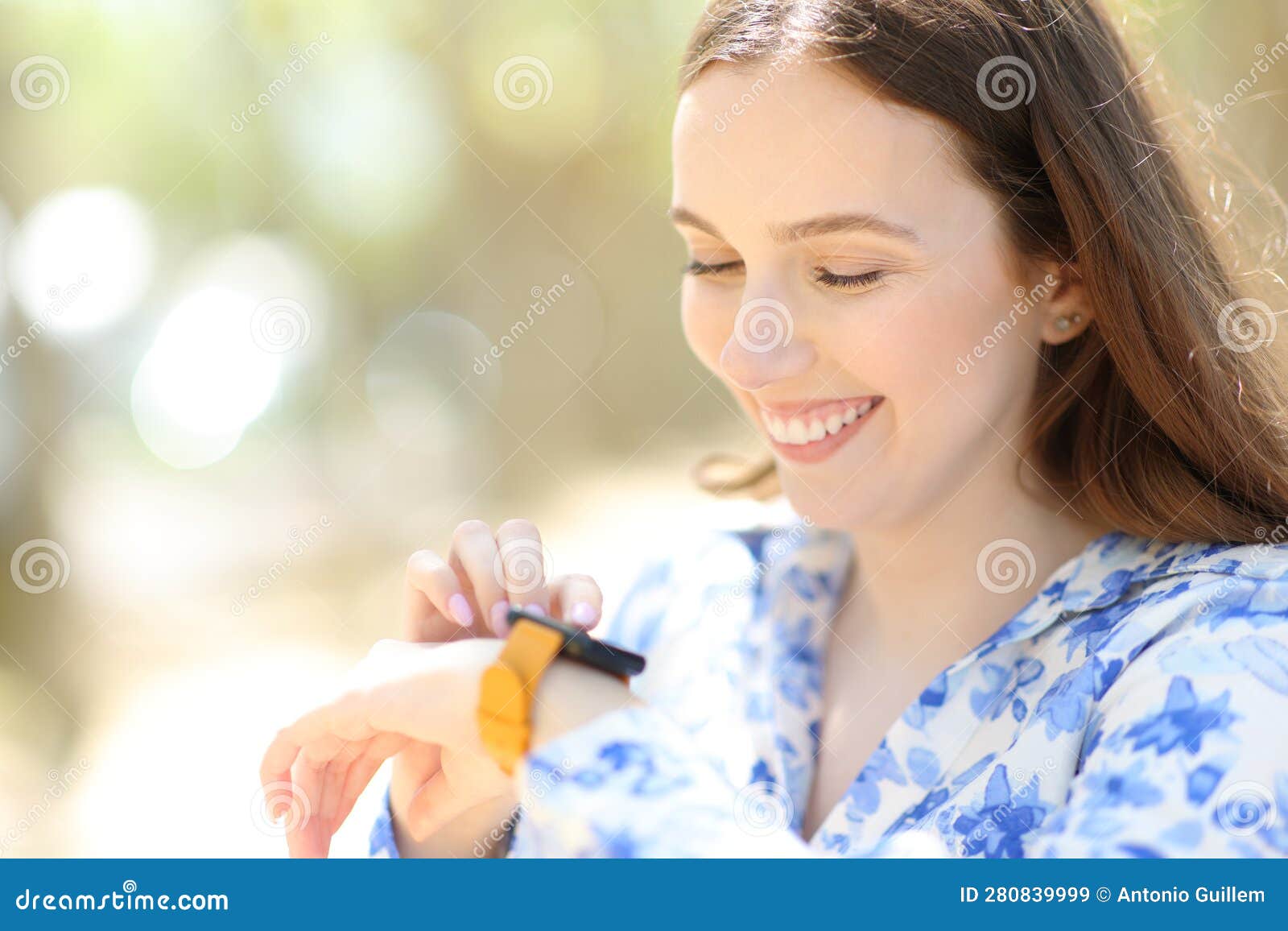 Happy Woman Using Smartwatch in a Sunny Park Stock Image - Image of ...