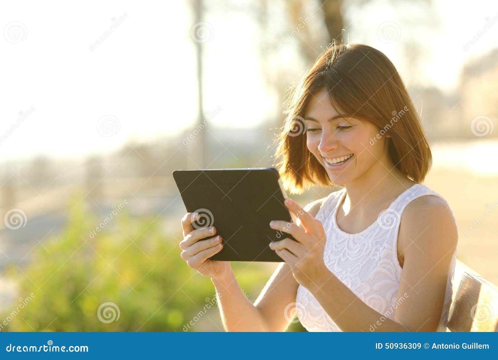 Happy Woman Using a Tablet Outdoors Stock Image - Image of holding ...