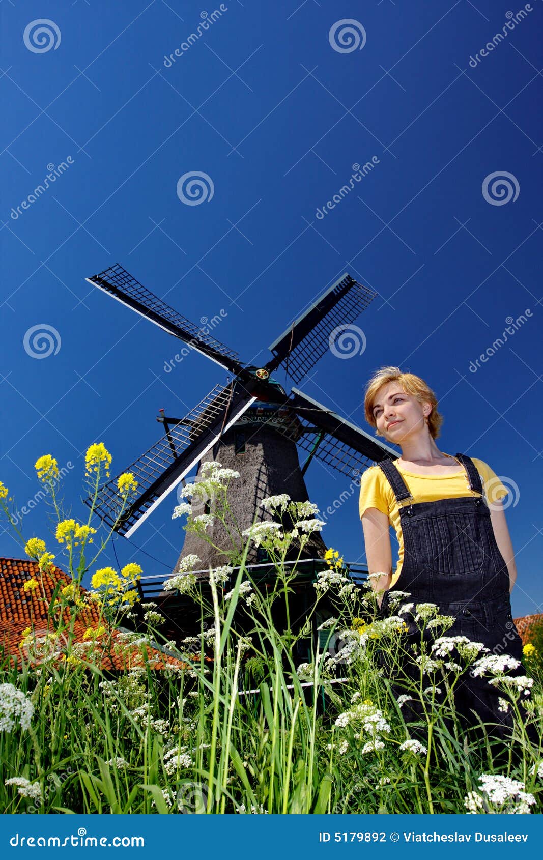 Happy Woman in Village with Windmill Stock Photo - Image of cute ...