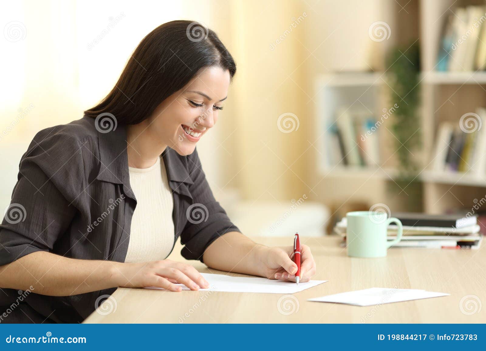 Happy Woman Writing Letter on a Table at Home Stock Image - Image of ...