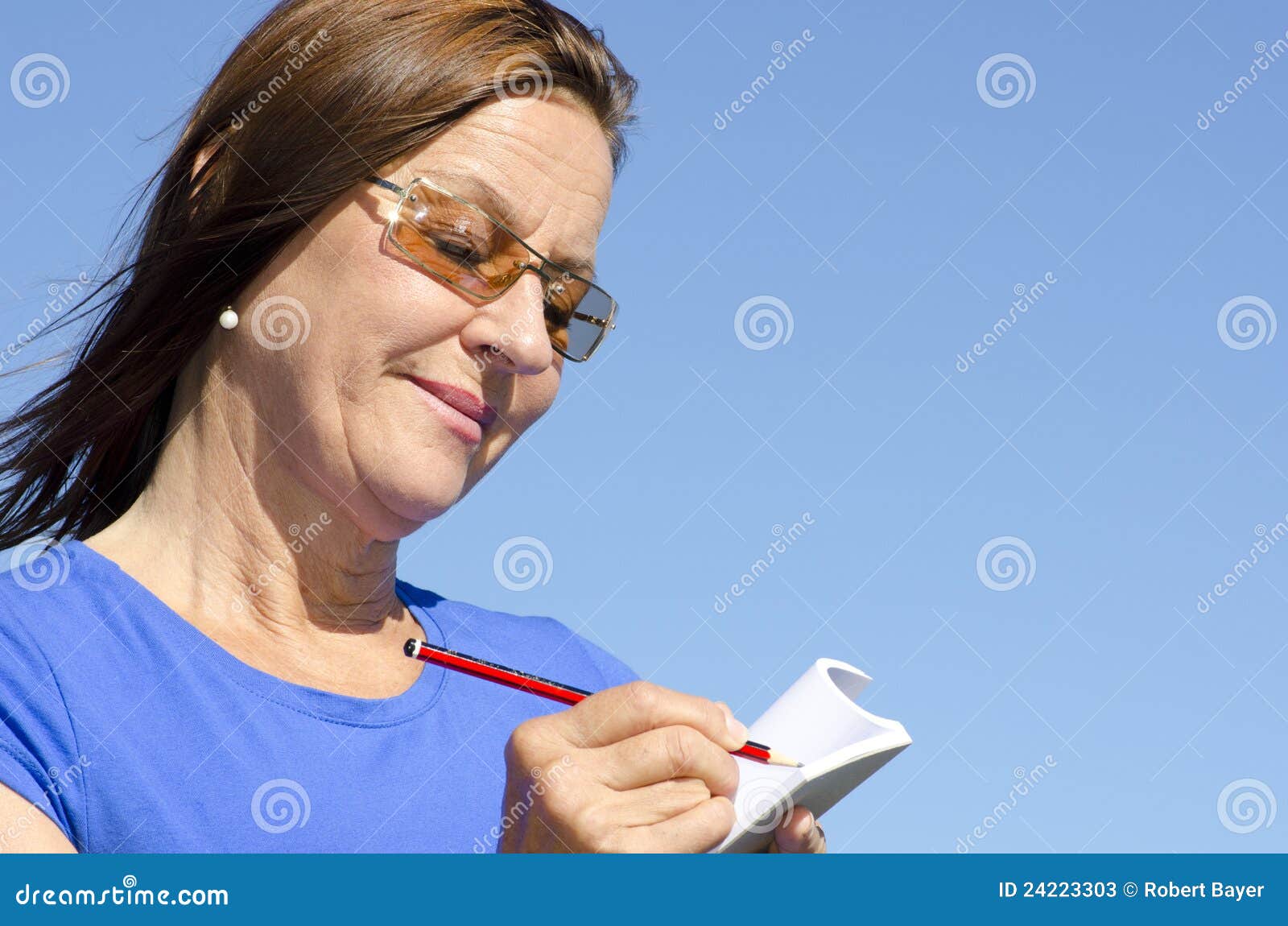 Happy woman writing a note stock image. Image of biro - 24223303