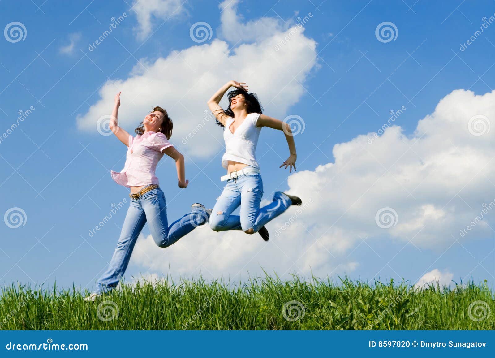 Happy Women Jumping on the Green Grass Stock Photo - Image of enjoyment ...