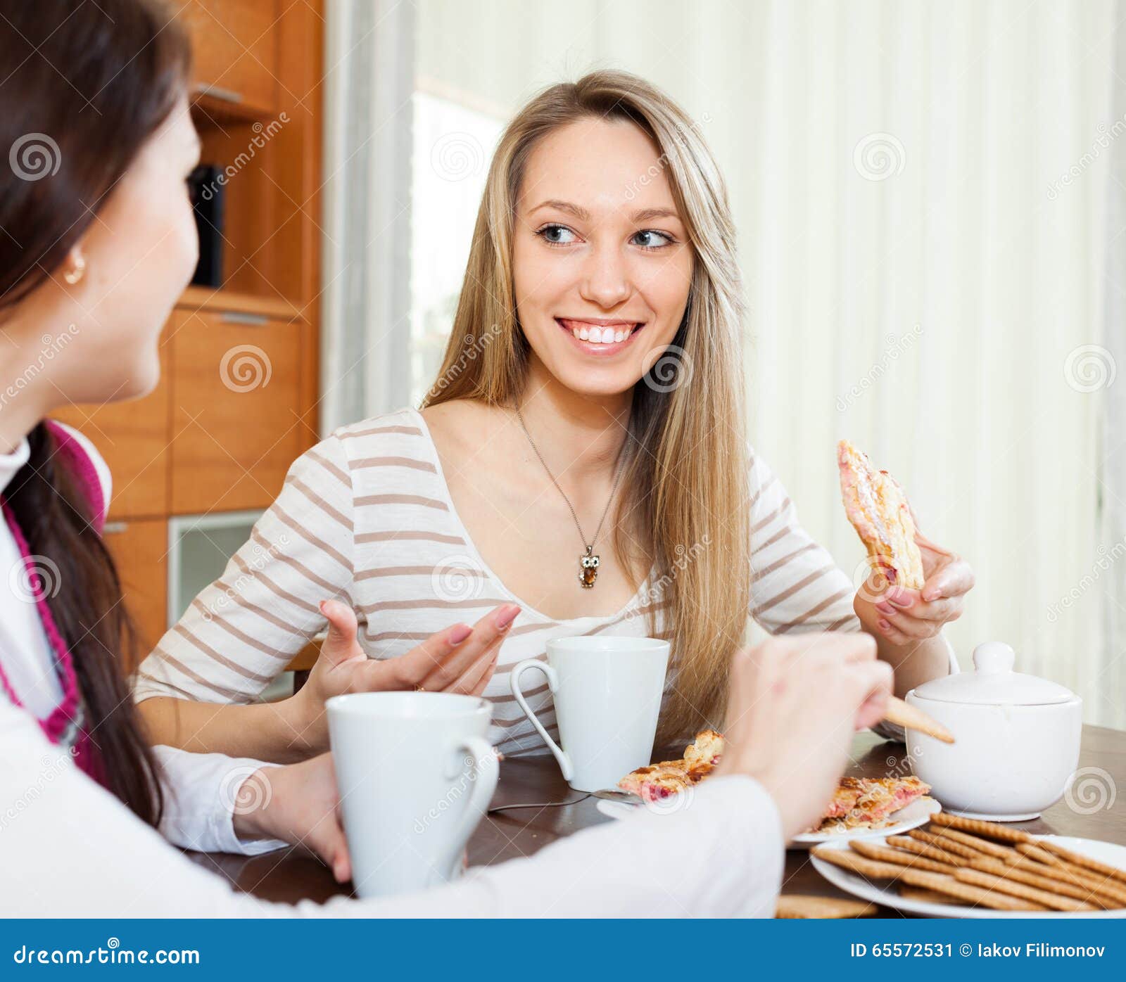 Happy Women Over Tea Table in Kitchen Stock Image - Image of friends ...