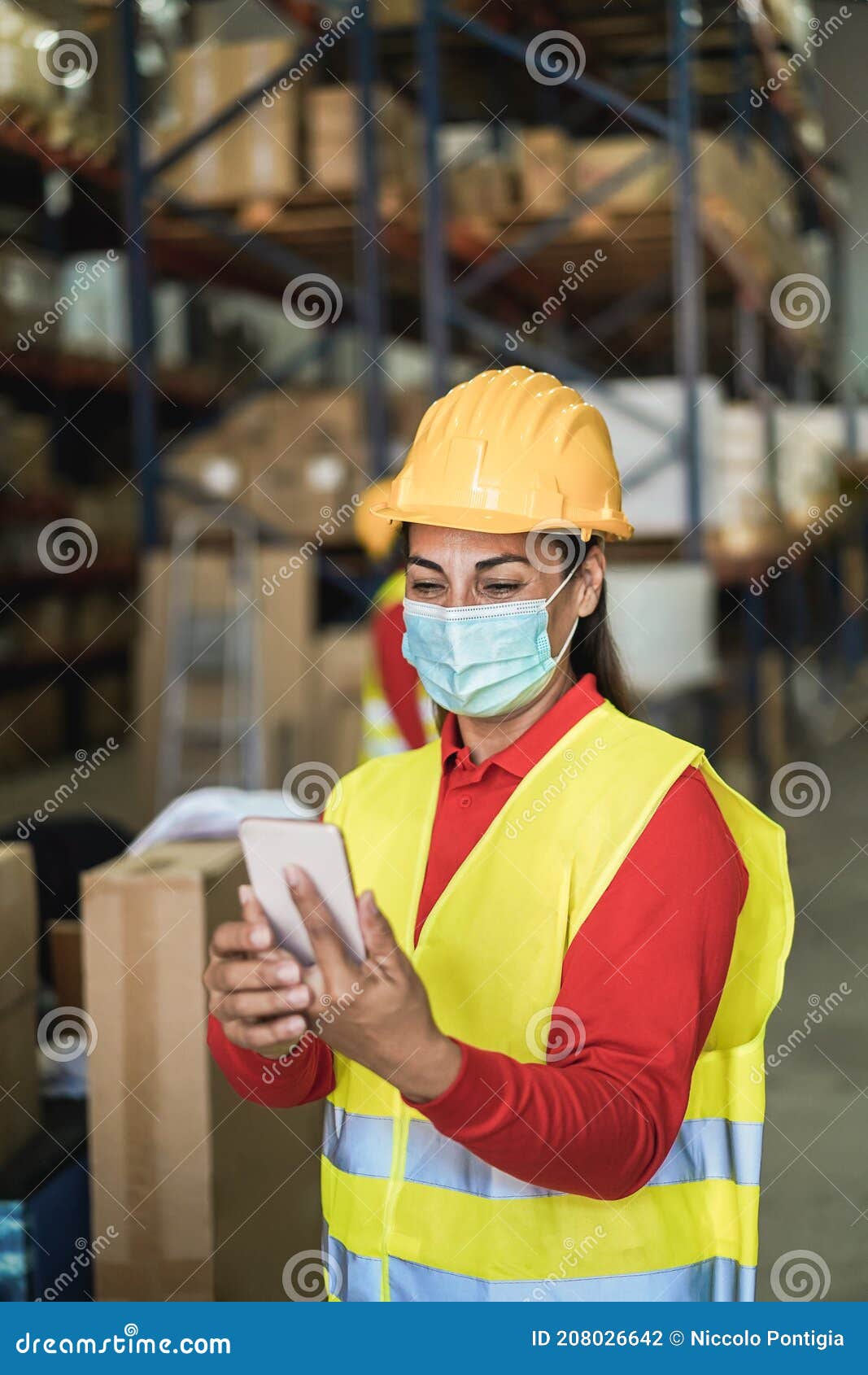 Happy Worker Women Using Mobile Phone Inside Warehouse - Focus on Face ...
