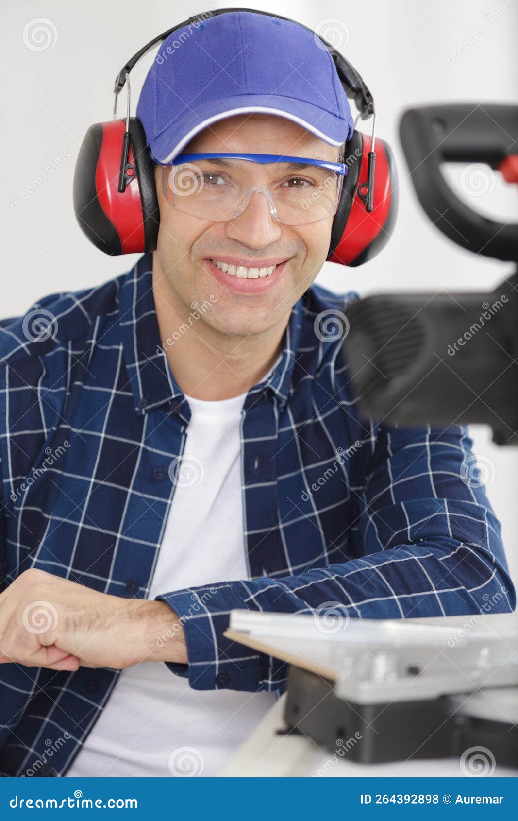 Happy Workman Cutting Wooden Planks Using Circular Saw in Workshop ...