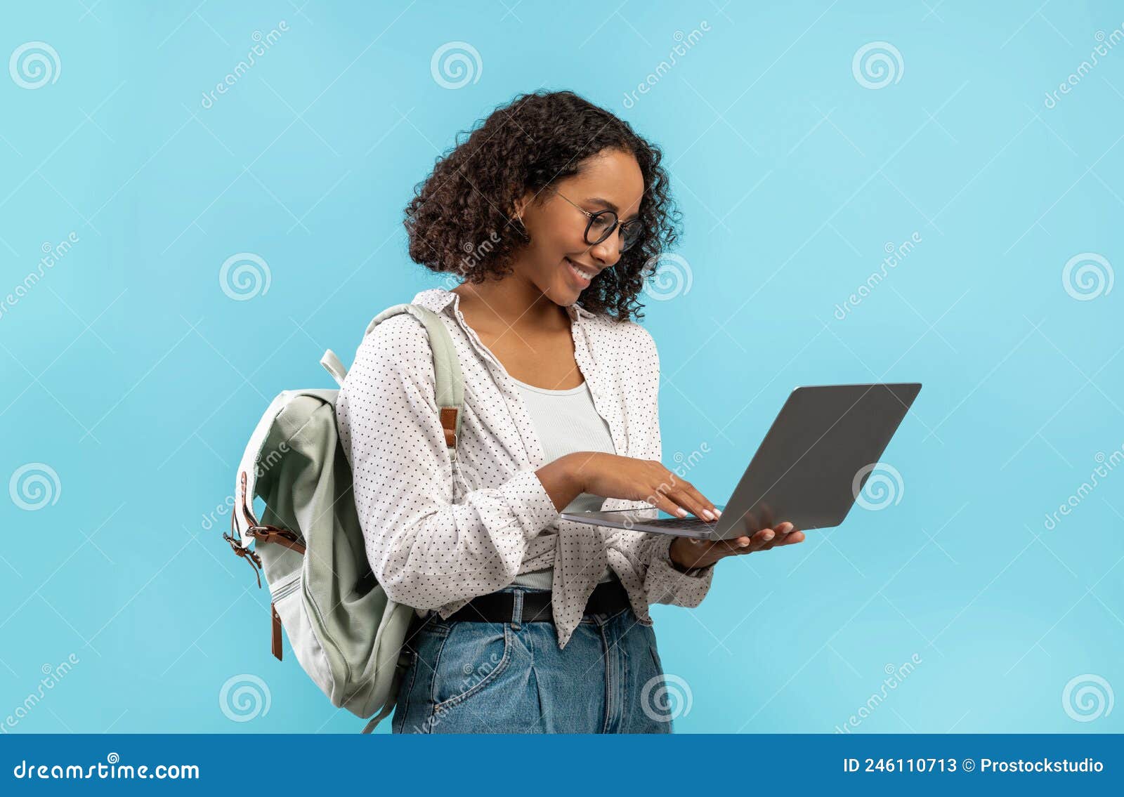 Happy Young African American Female Student with Backpack Using Laptop ...