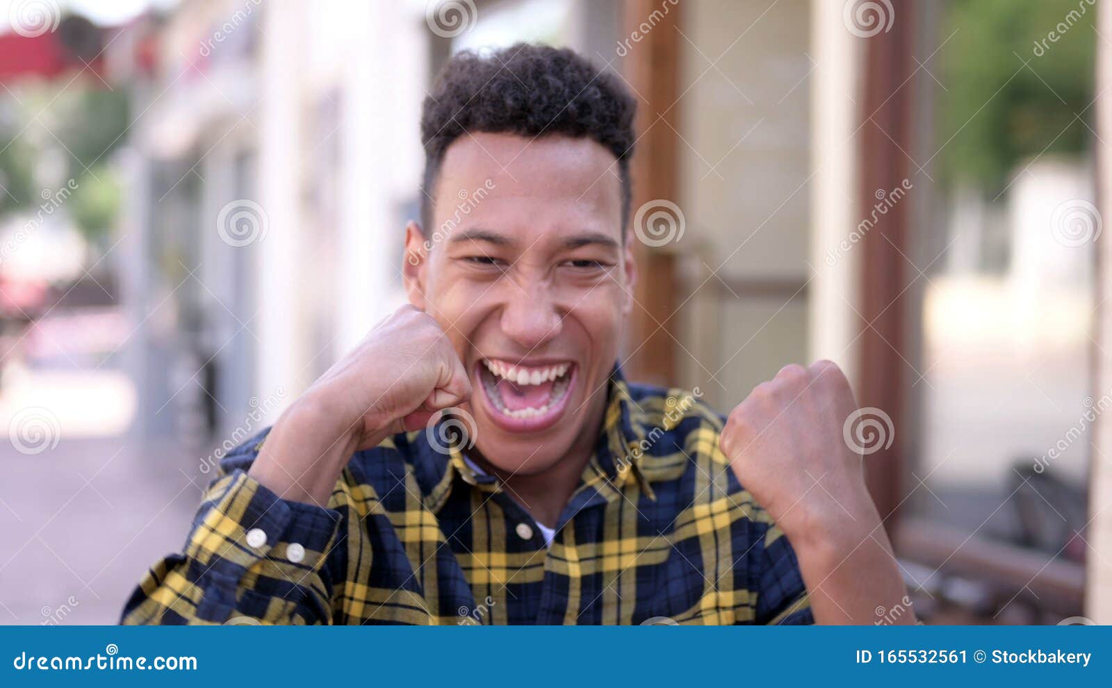 The Happy Young African Man Celebrating Success Stock Image - Image of ...