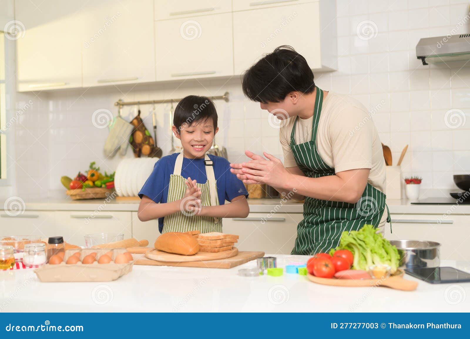 Happy Young Asian Father and Son Cooking in Kitchen at Home Stock Image ...
