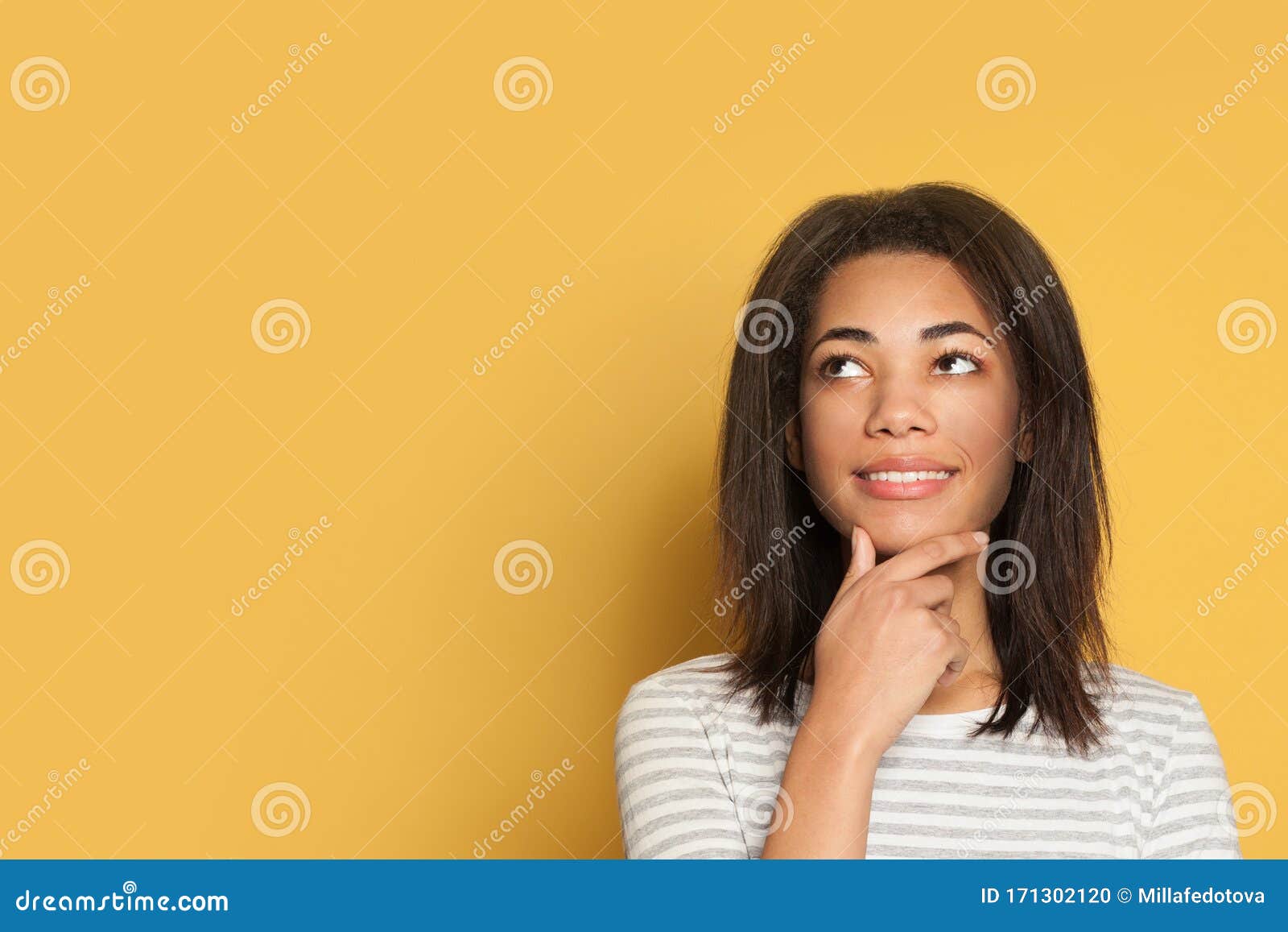 Happy Young Black Woman Thinking on Yellow Background Stock Photo ... Happy Young Black Woman Thinking on Yellow Background Stock Photo ...