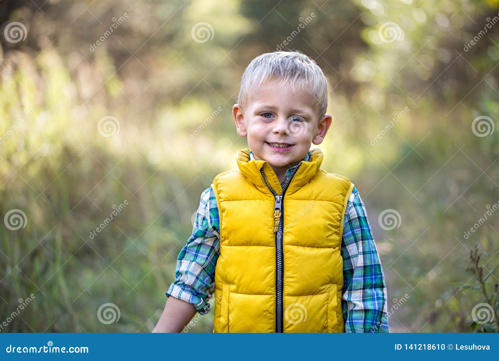 Happy Young Boy in the Forest Looking at the Camera Stock Photo - Image ...