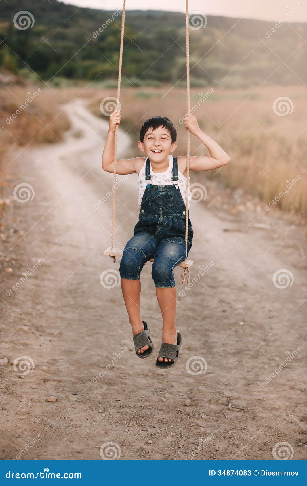 Happy Young Boy Playing on Swing in a Park Stock Image - Image of child ...