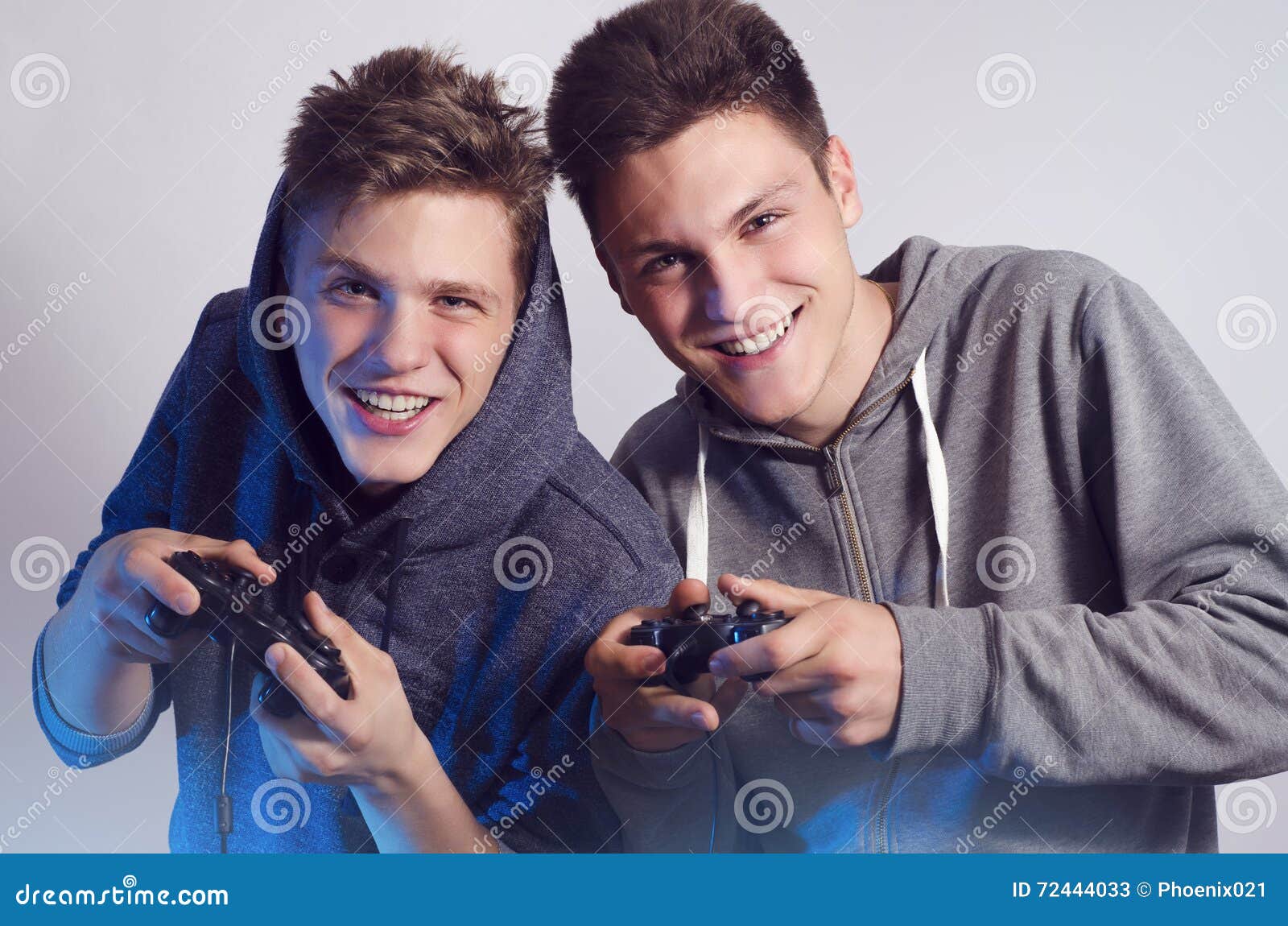 Happy Young Brothers Playing Video Games, Selective Focus on Faces ...