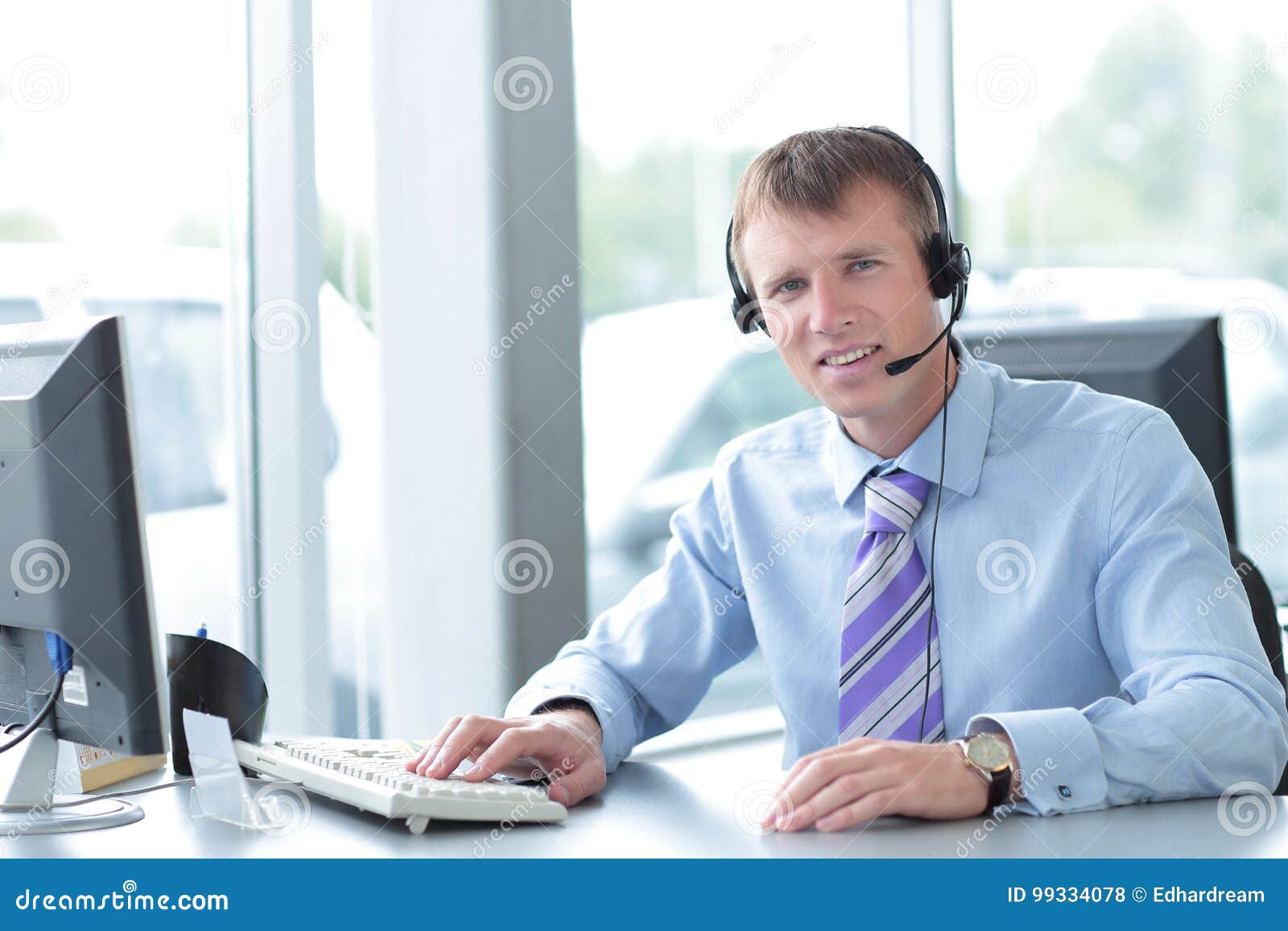 Happy Young Business Man in Headset Working on Computer. Stock Photo ...