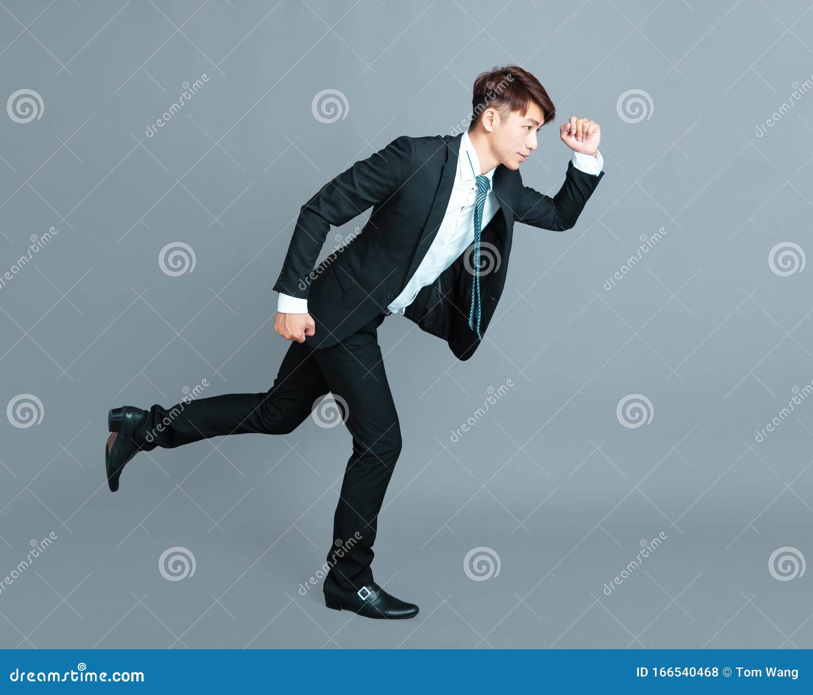 Happy Young Business Man Running in Motion Stock Photo - Image of ...